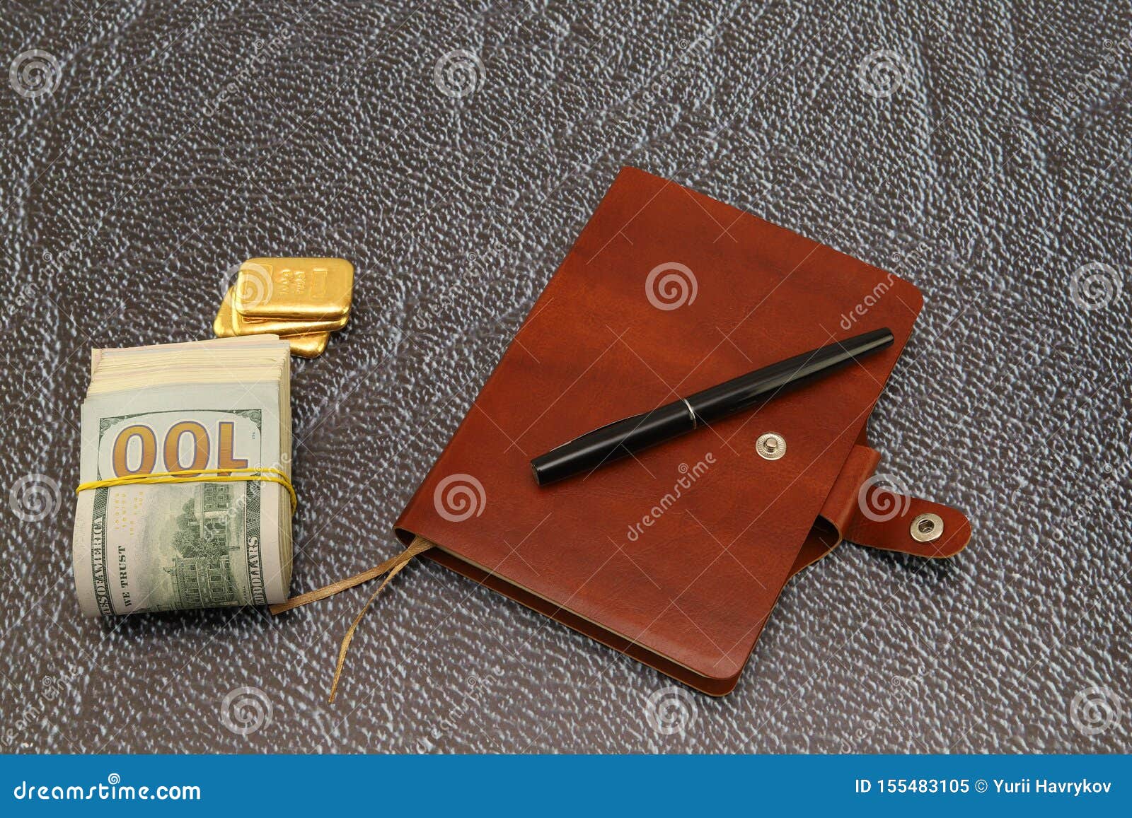 On the Table is a Pack of Dollars and Gold Bars. Horizontal Composition ...