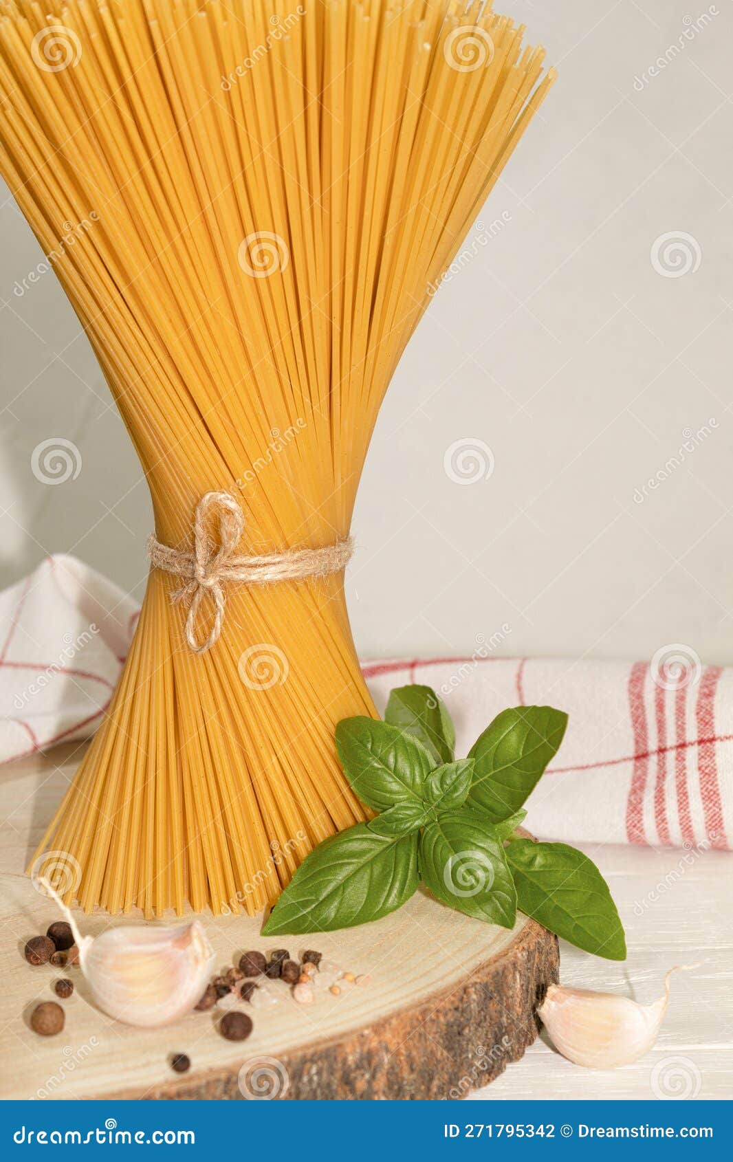 On the Table is a Pack of Spaghetti Tied with String Stock Photo ...