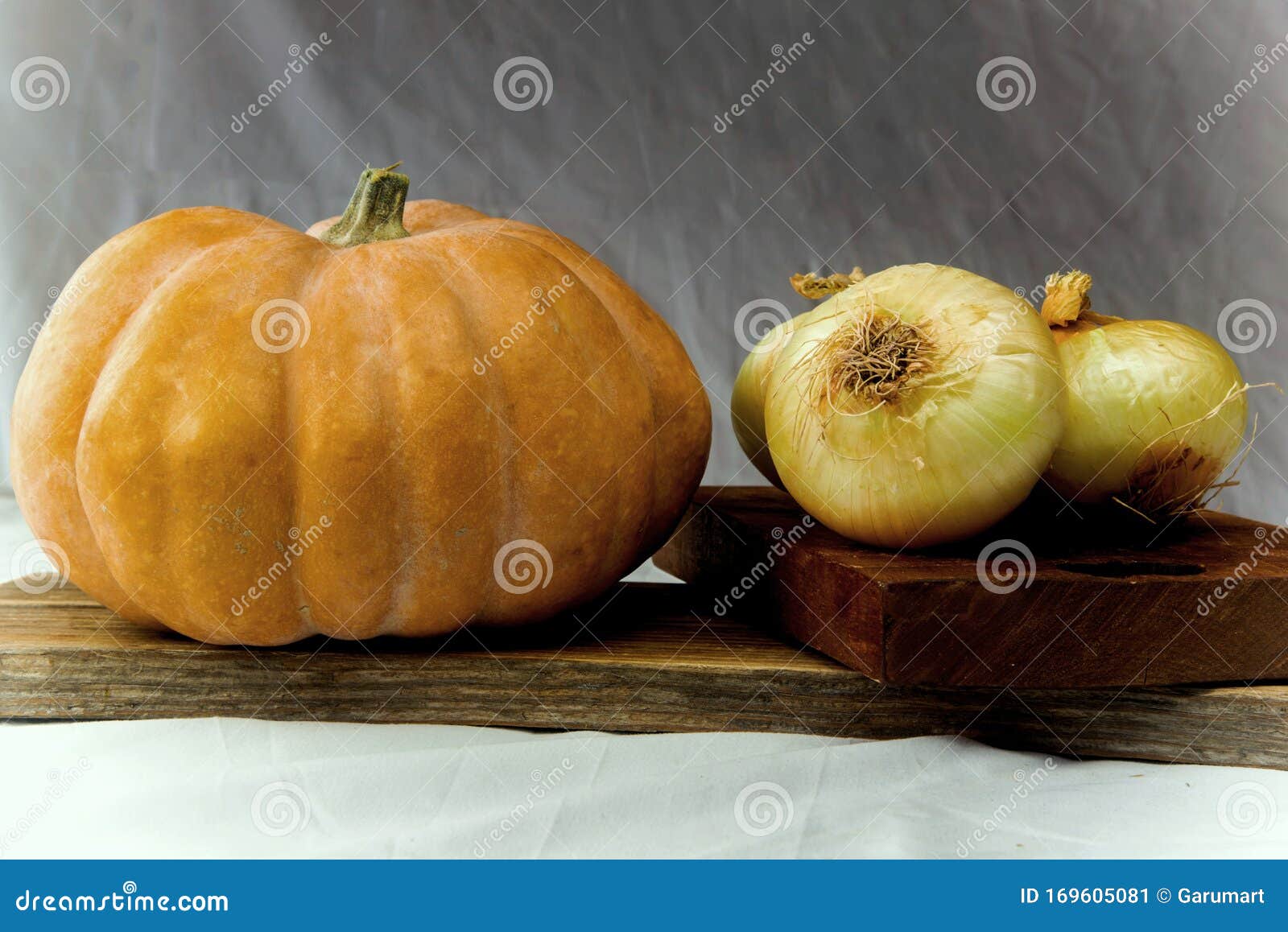 Table with Pumpkin and Sweet Onions in a Rustic Kitchen Stock Image ...