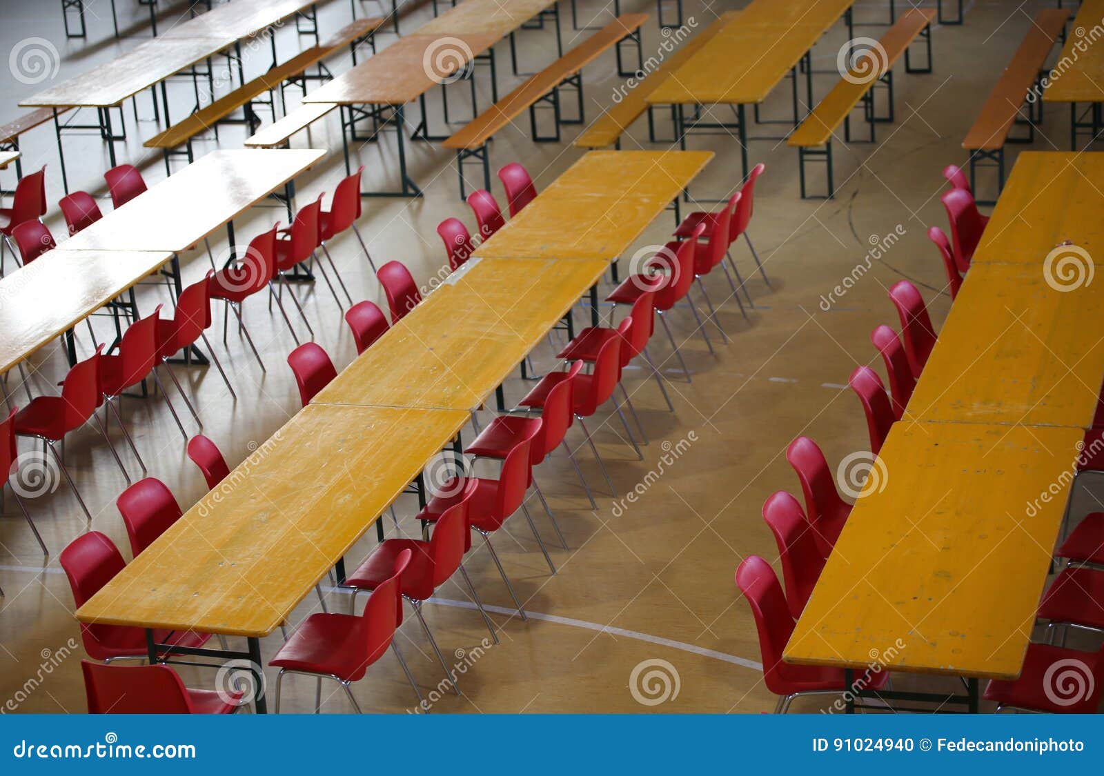 Table with Red Chairs in a Wide Lunch Room Stock Photo - Image of ...