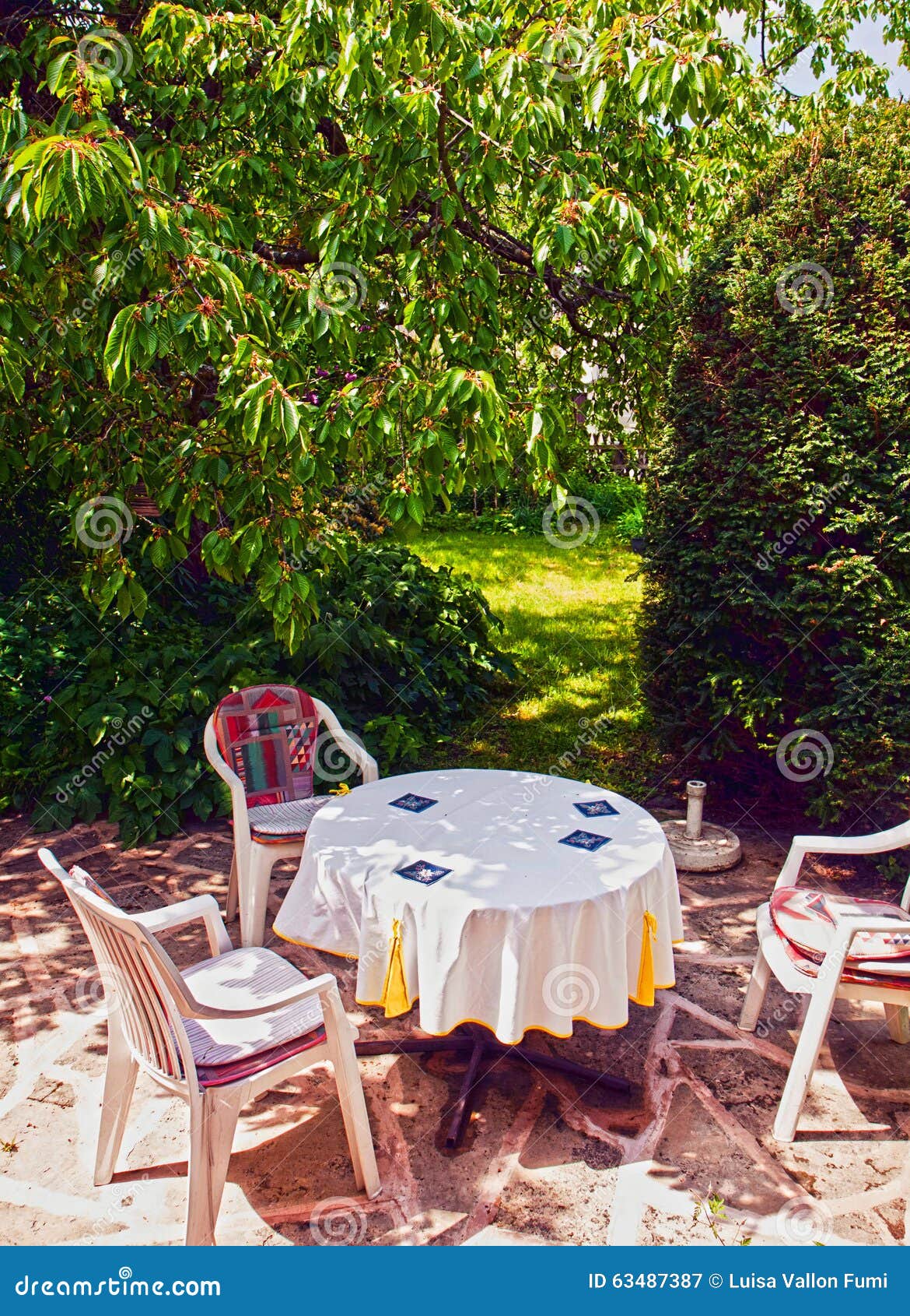 Table and Seats in the Garden Under Cherry Tree Stock Image - Image of ...