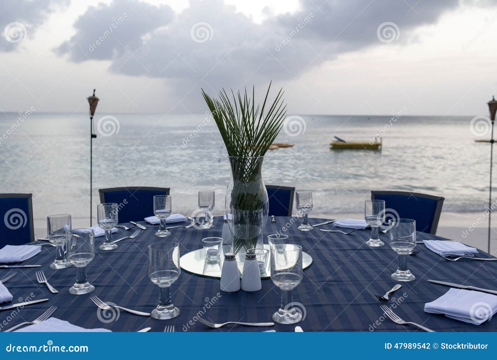 Table Set for Dinner on the Beach Stock Photo - Image of flower, glass ...