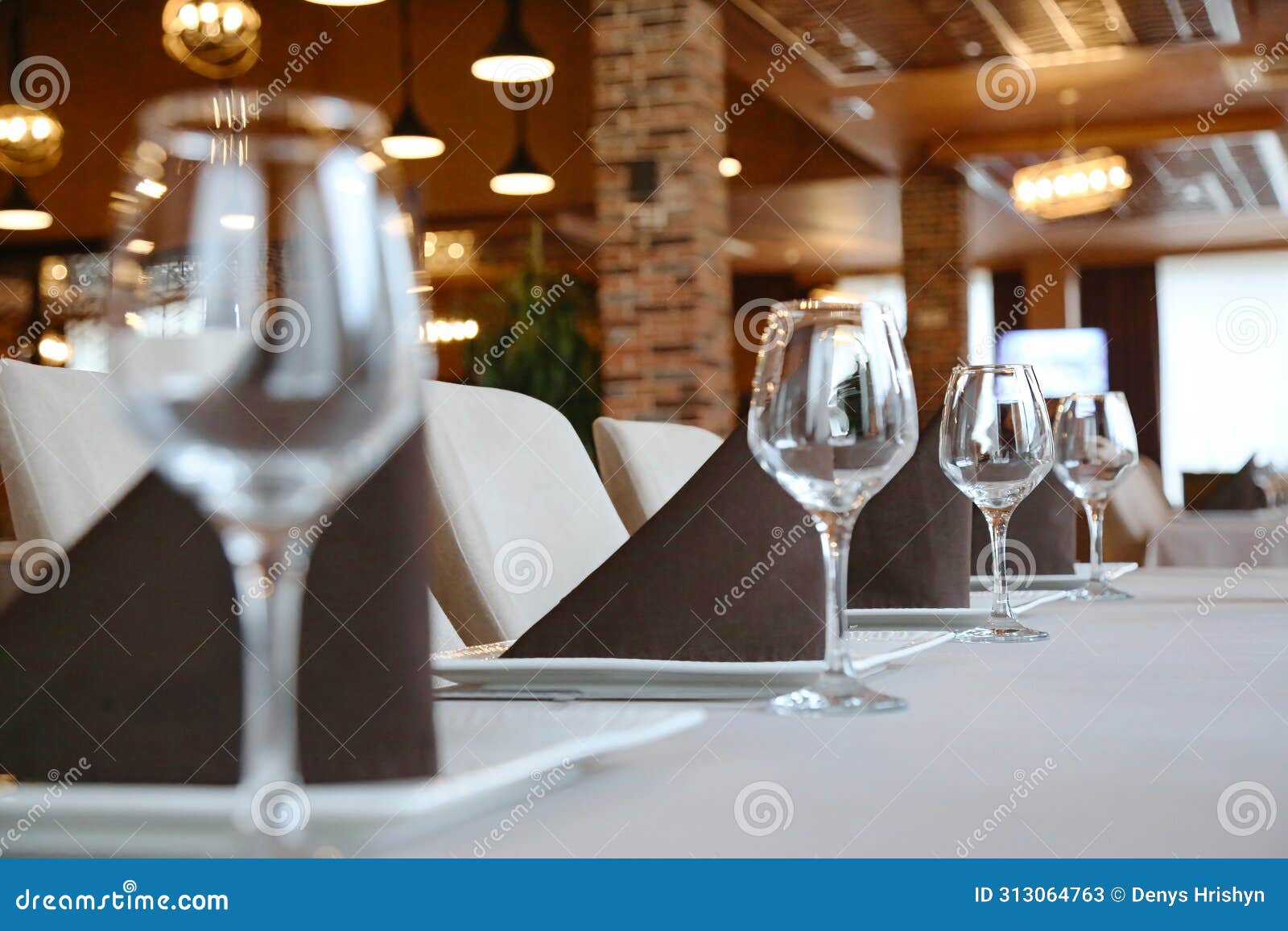 Table Set with Wine Glasses and Plates for a Formal Dinner Stock Image ...