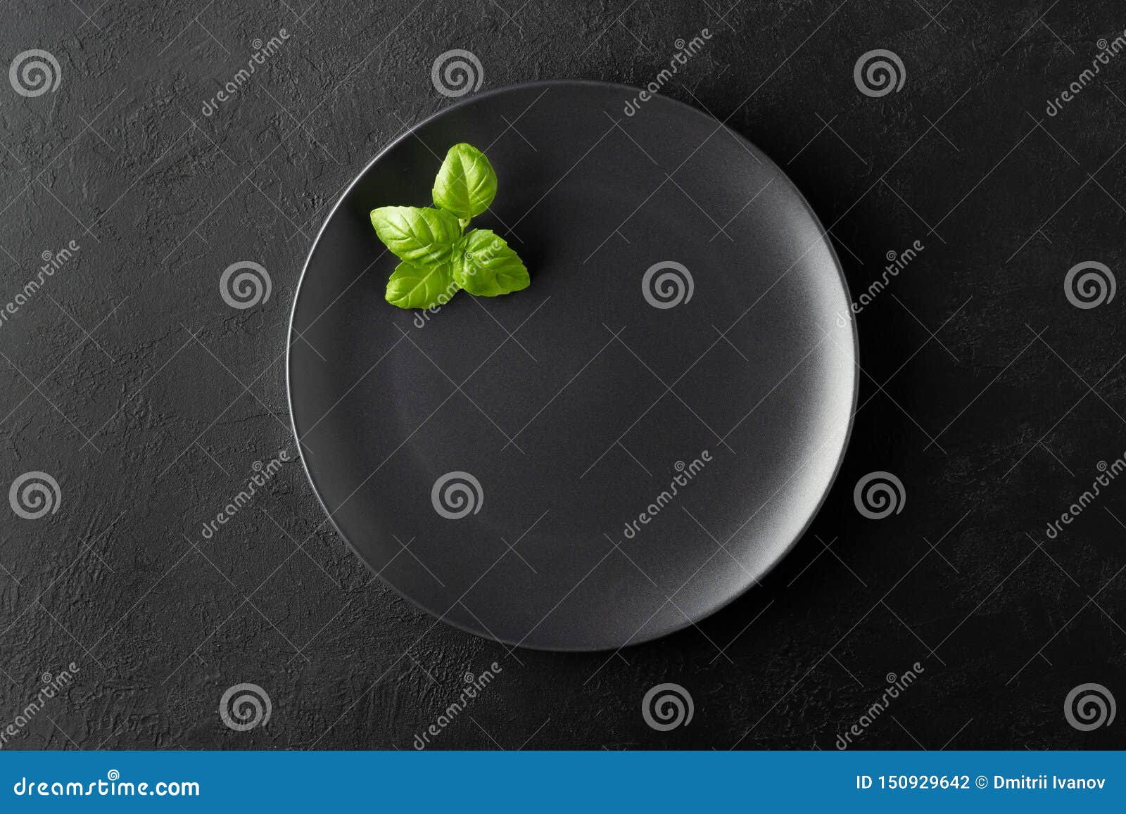 Table Setting. Black Plate and Basil Leaves. Stock Photo - Image of ...