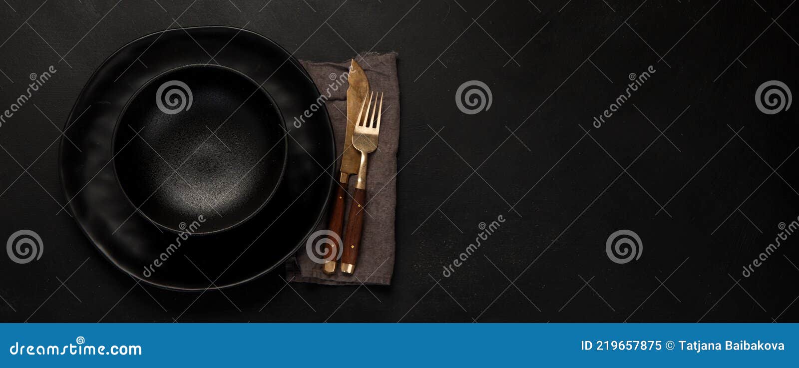 Table Setting with a Black Plates on a Black Background. Minimalism ...
