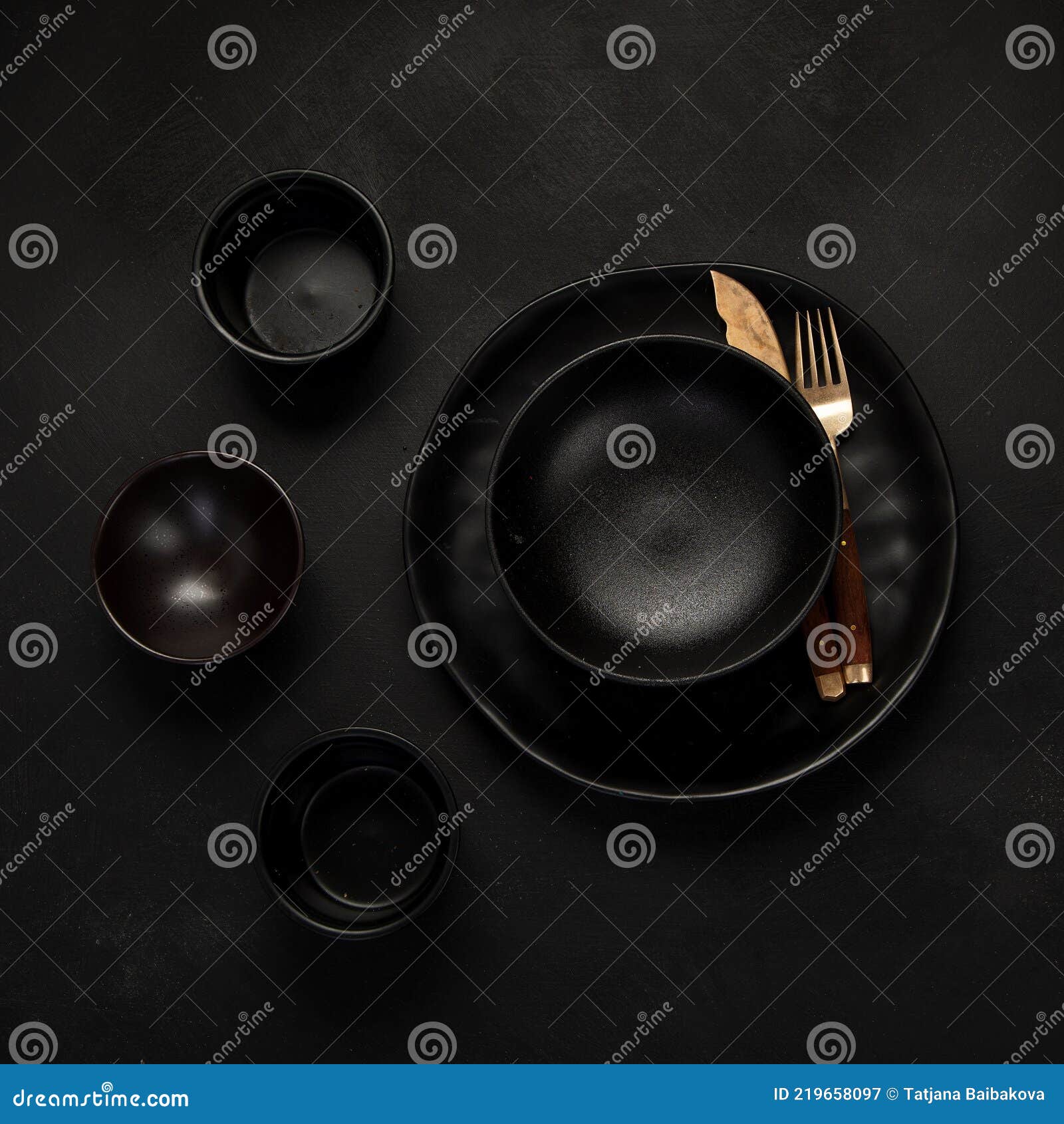 Table Setting with a Black Plates on a Black Background. Minimalism ...