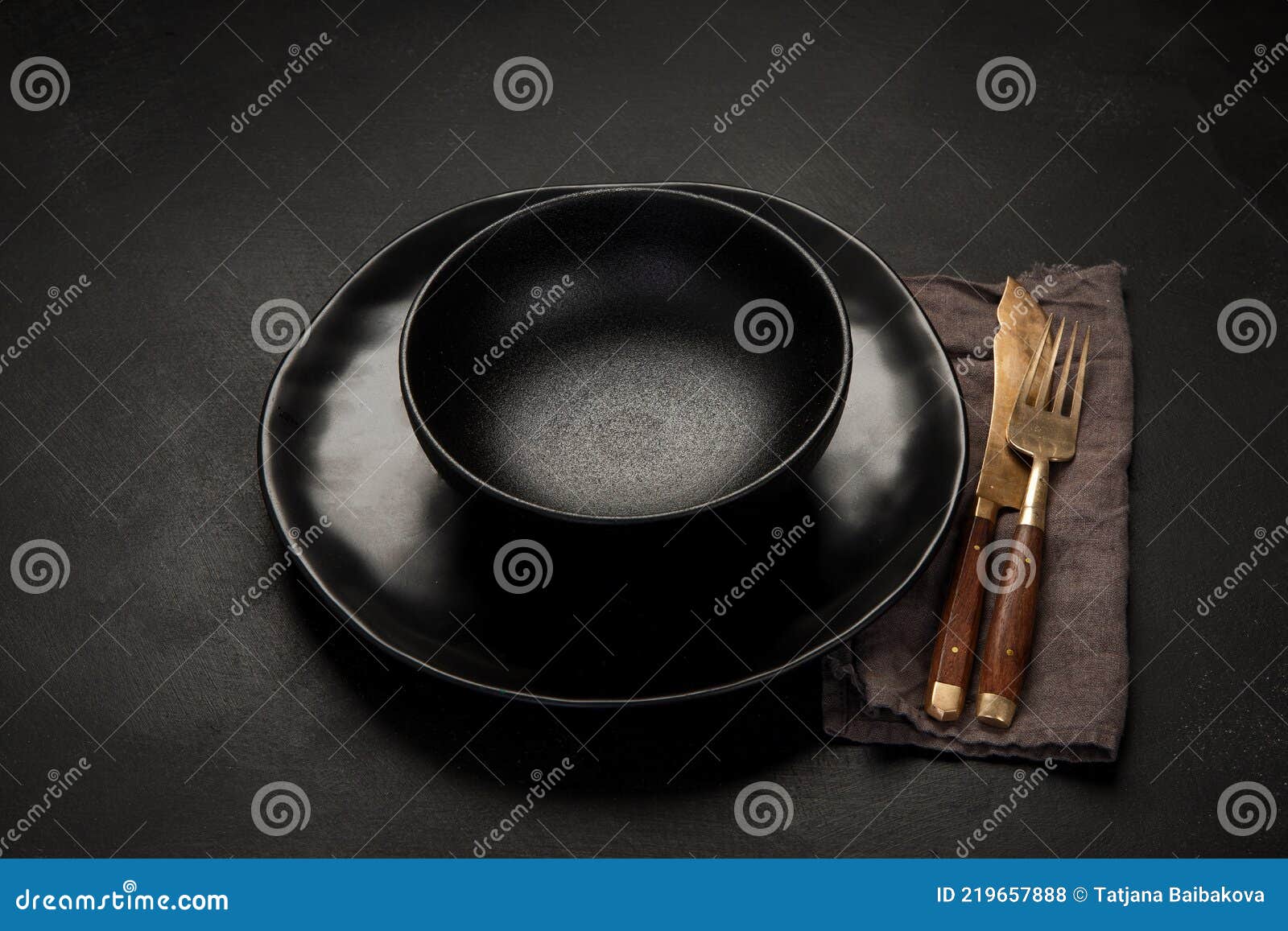 Table Setting with a Black Plates on a Black Background. Minimalism ...