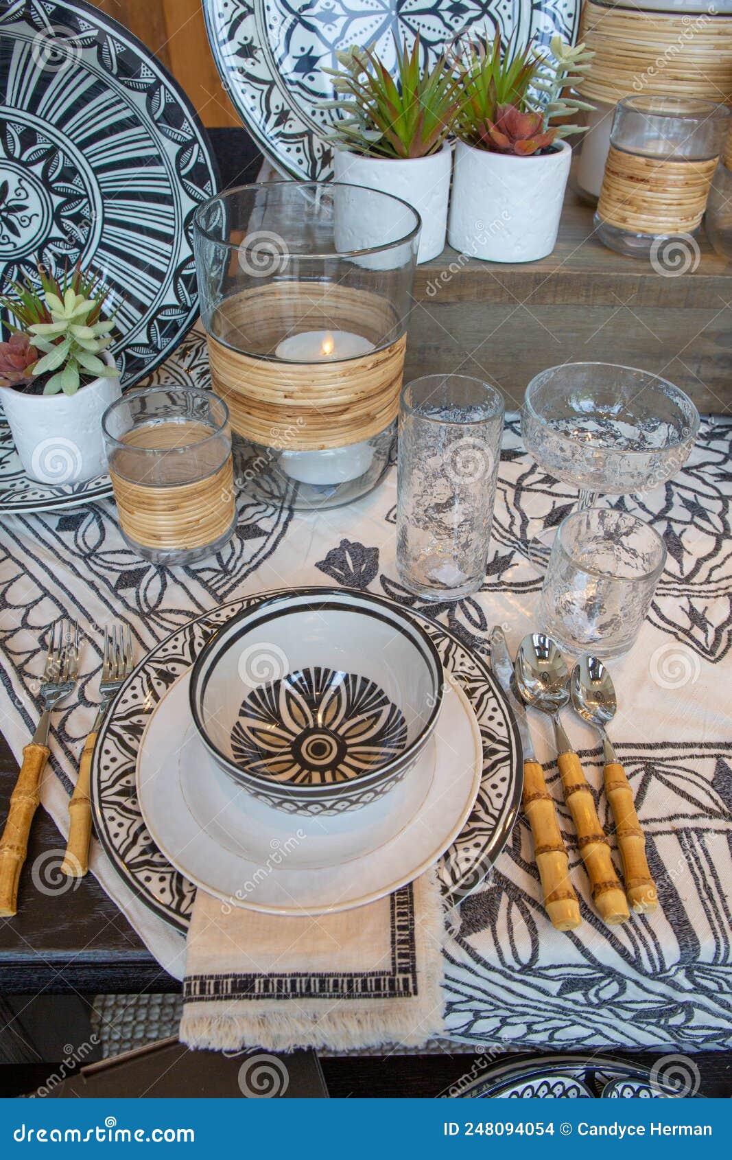 Table Setting with Black and White Dishes Stock Photo - Image of ...