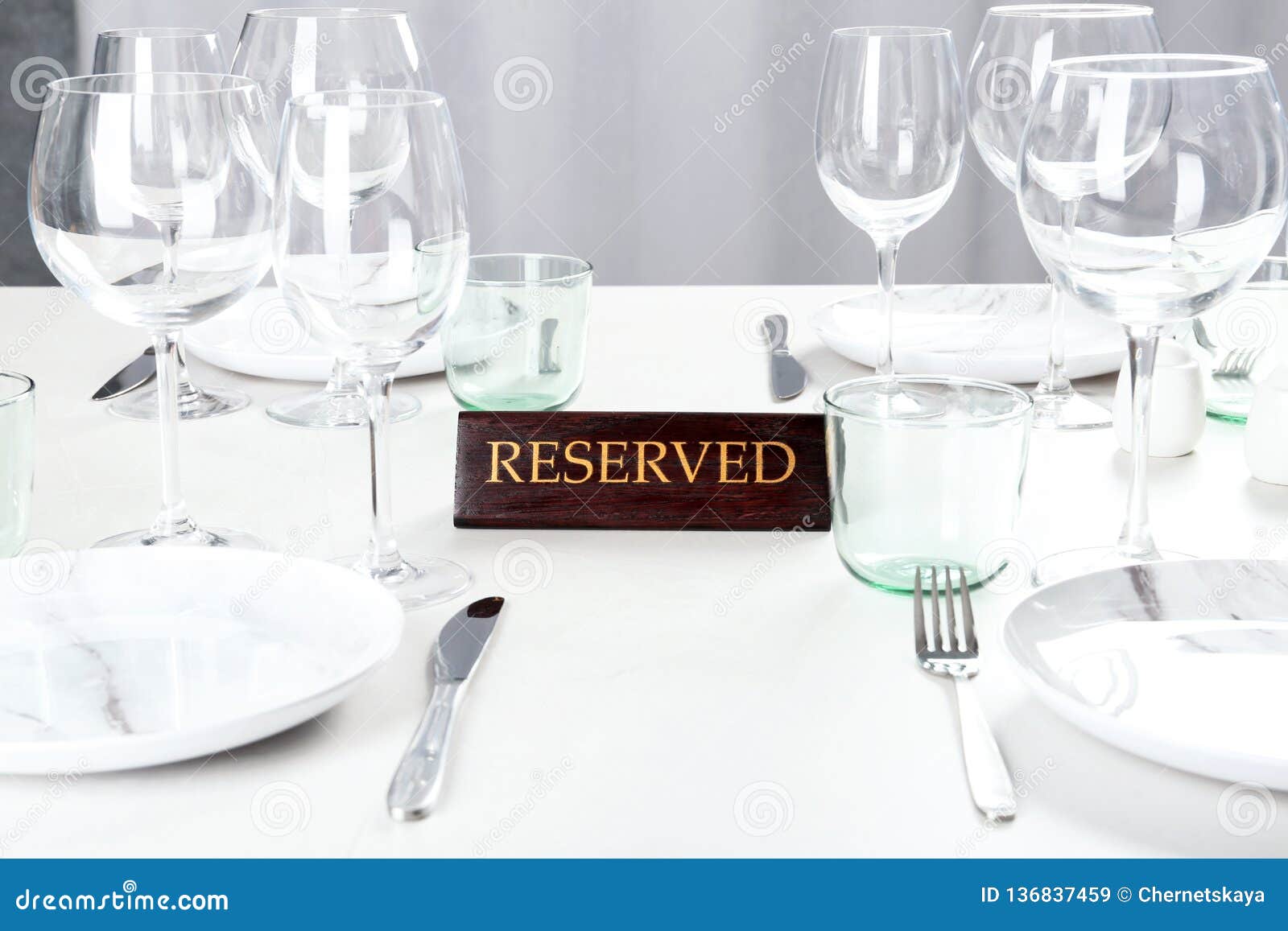 Table Setting with RESERVED Sign Stock Image - Image of plates ...
