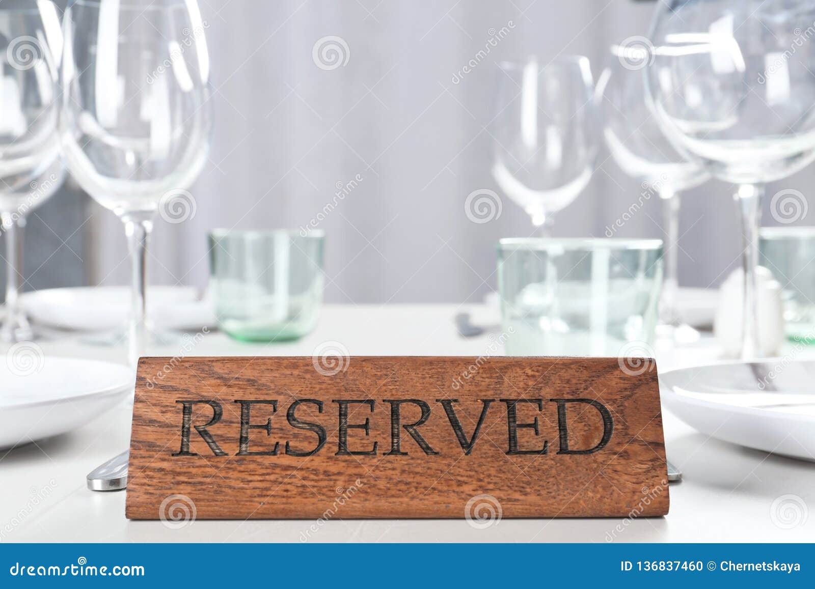 Table Setting with RESERVED Sign in Restaurant Stock Photo - Image of ...