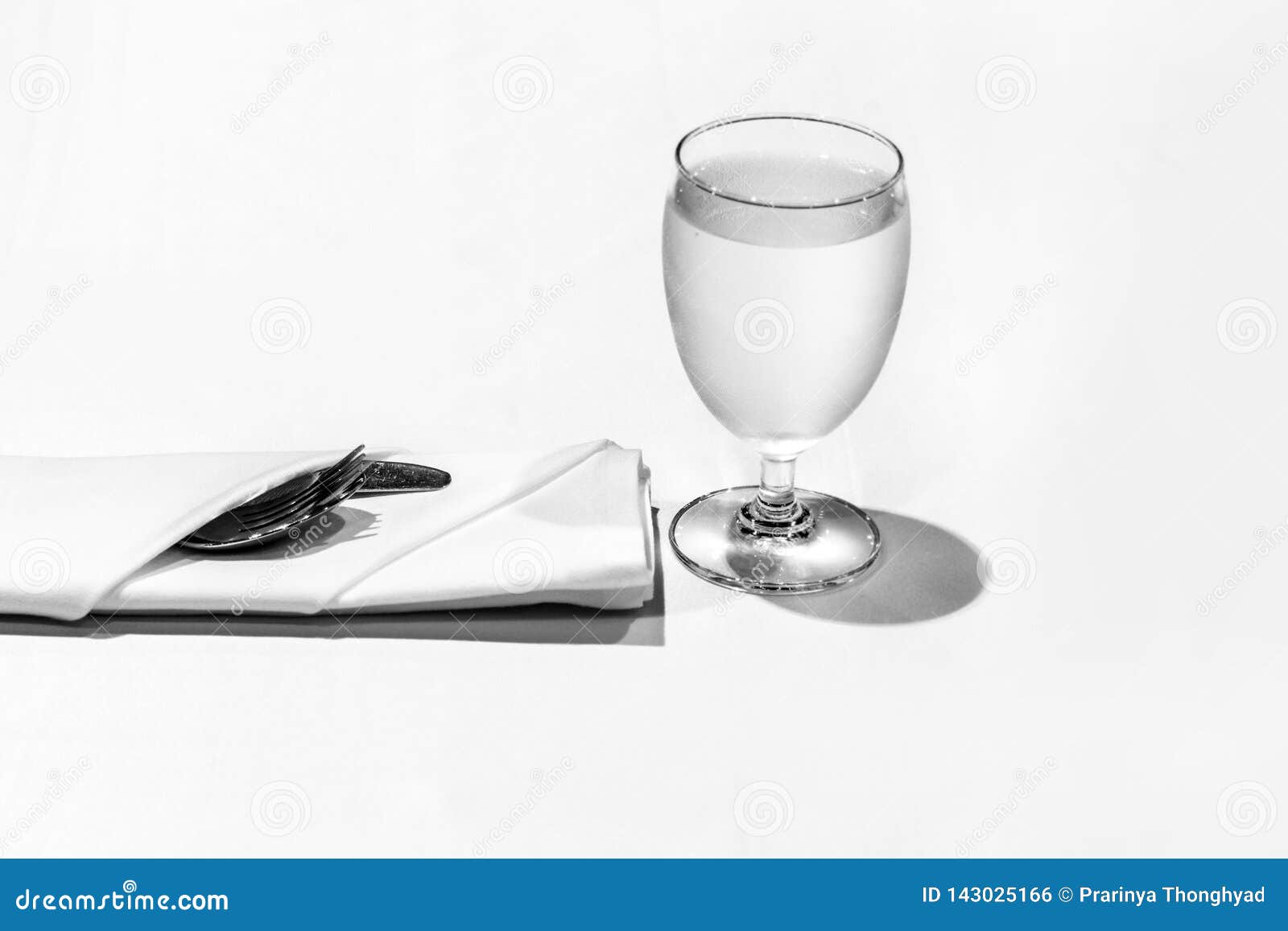 Table Setting in the Restaurant, Water in the Grass on the Dining Table ...