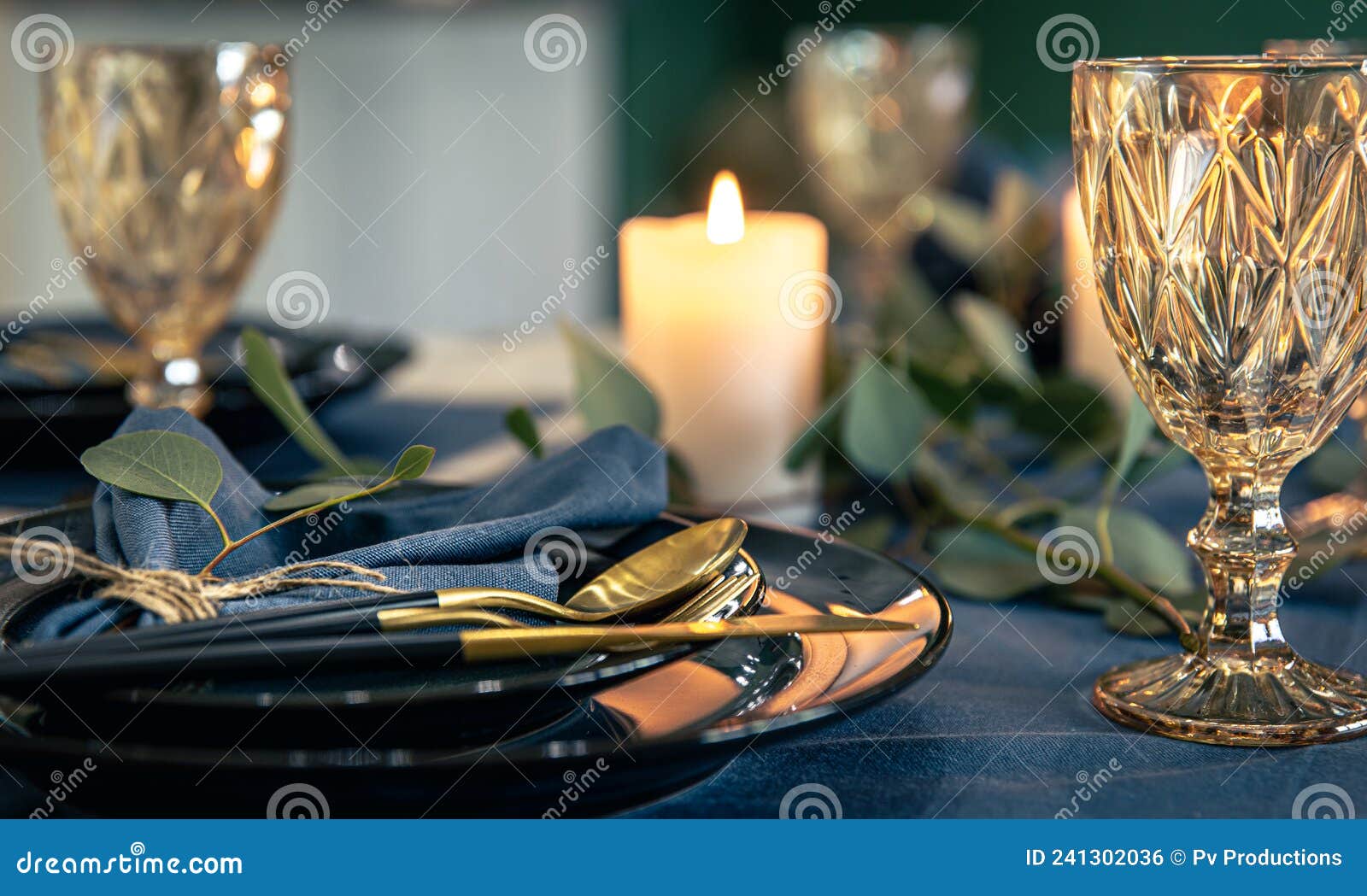 Table Setting with Textured Wine Glasses, Candles and Leaves. Stock ...