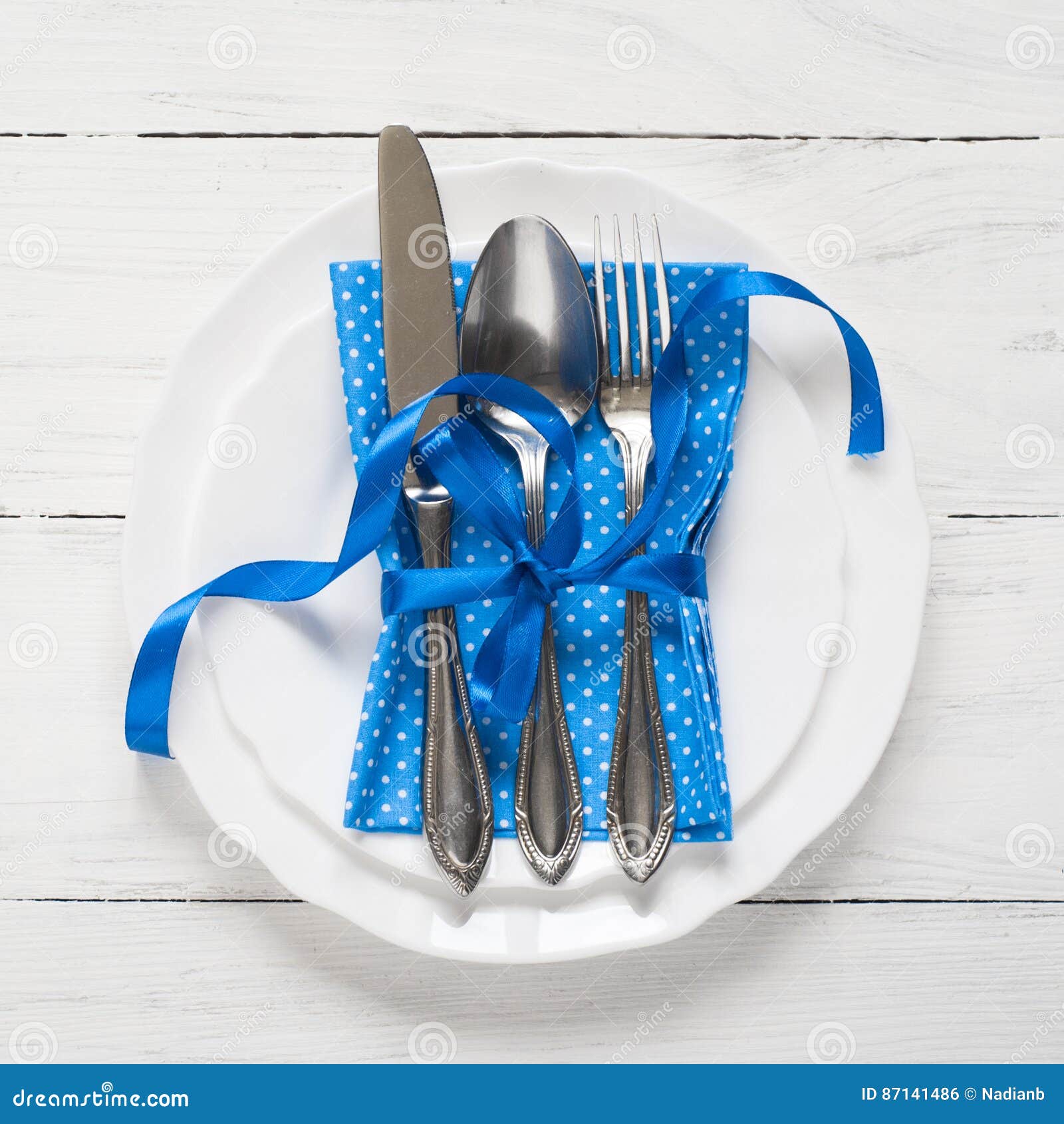Table Setting with White Plates Blue Napkin Stock Photo - Image of ...