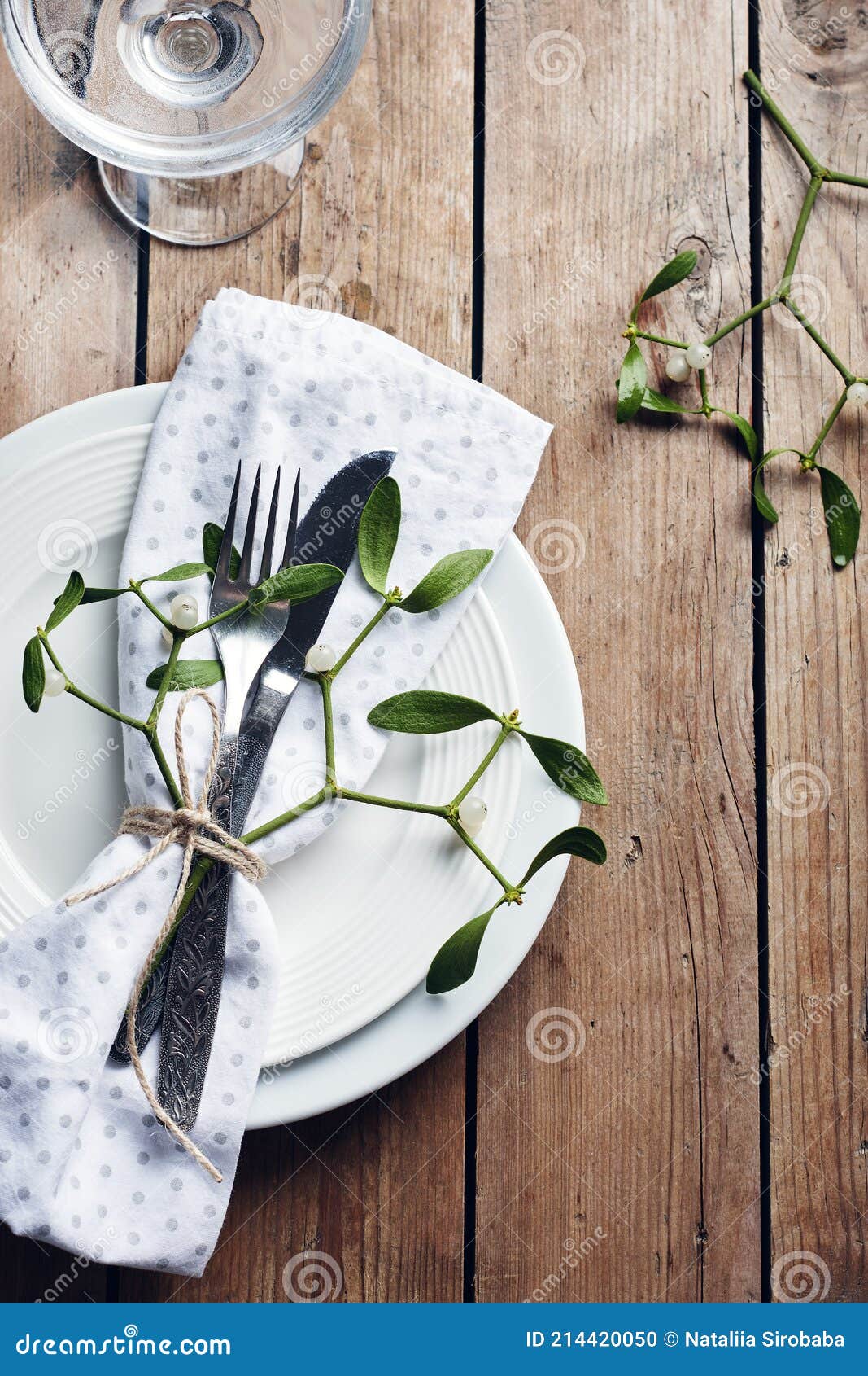 Table Setting with White Plates and Mistletoe Stock Photo - Image of ...