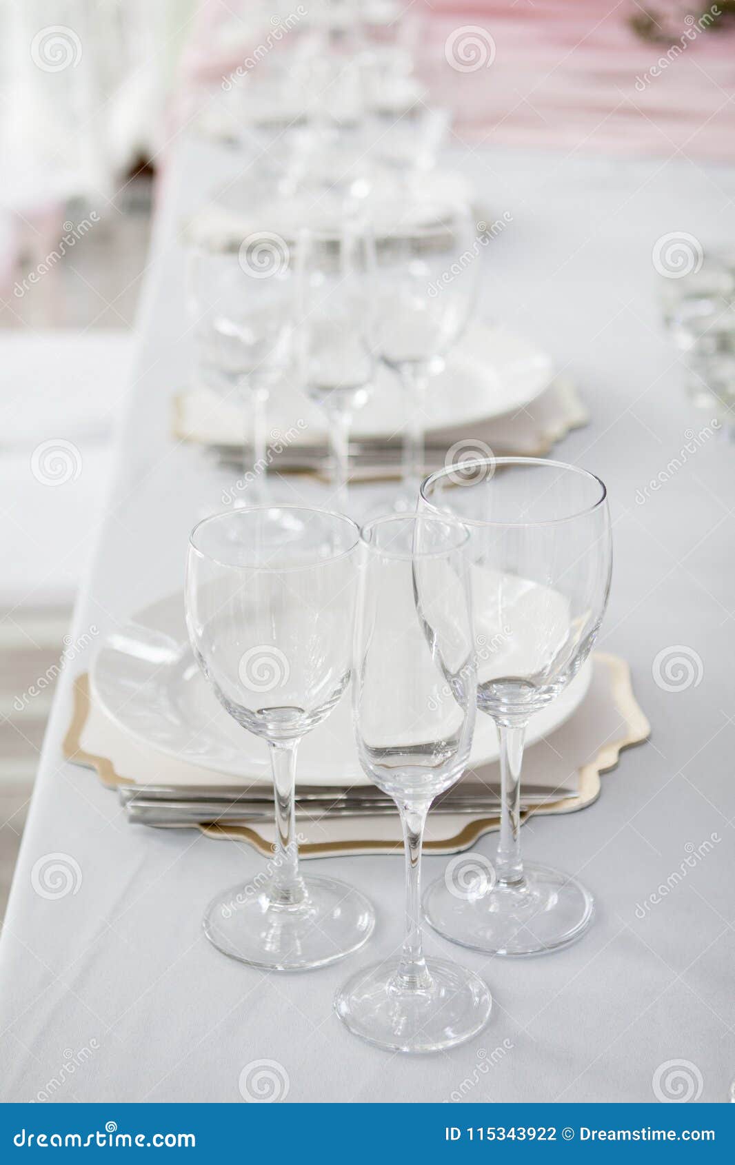 Table Setting with White Tablecloth, Glasses, White Plates Stock Photo ...
