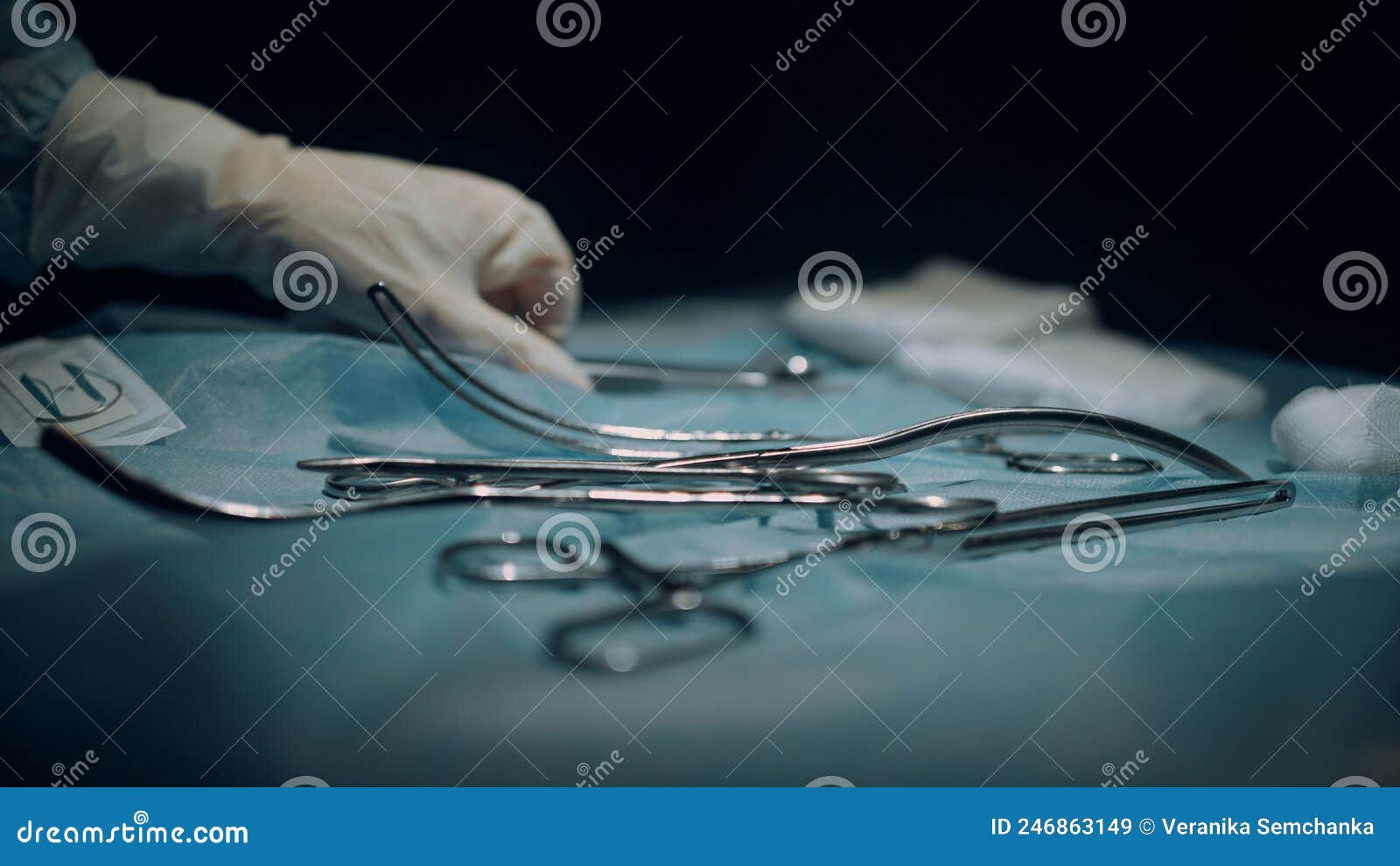 Table with Surgical Instruments in Dark Sterile Operating Room Side ...