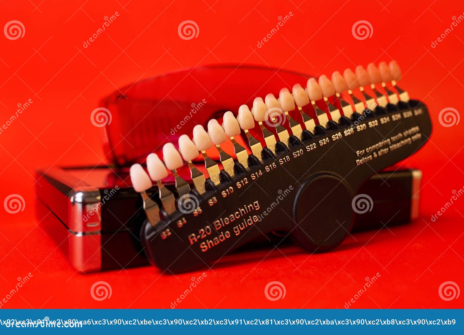Table of Teeth Color. Scale on a Red Background Close-up Stock Photo ...