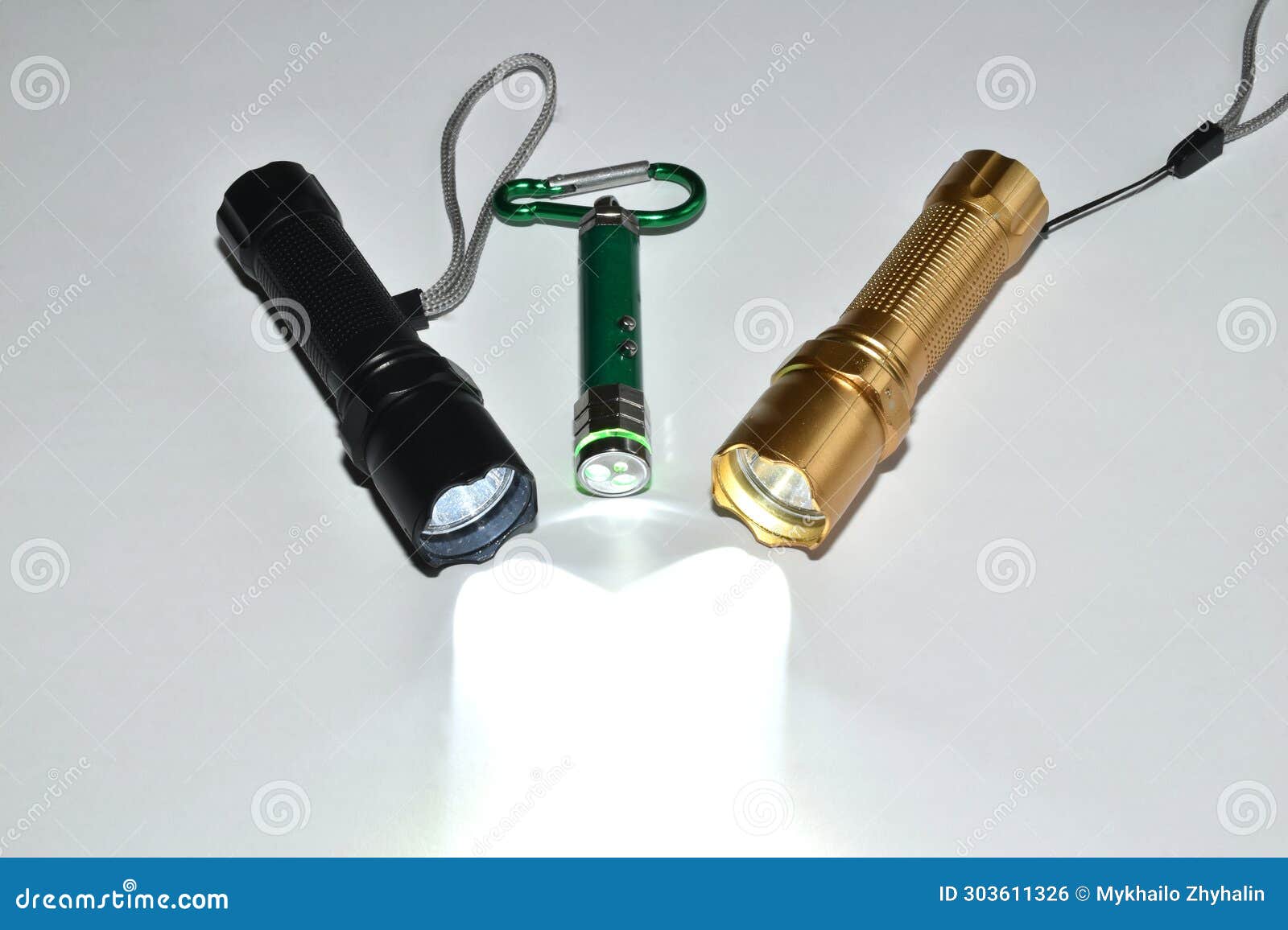 Three Flashlights of Different Shapes and Rays of Light from Them ...