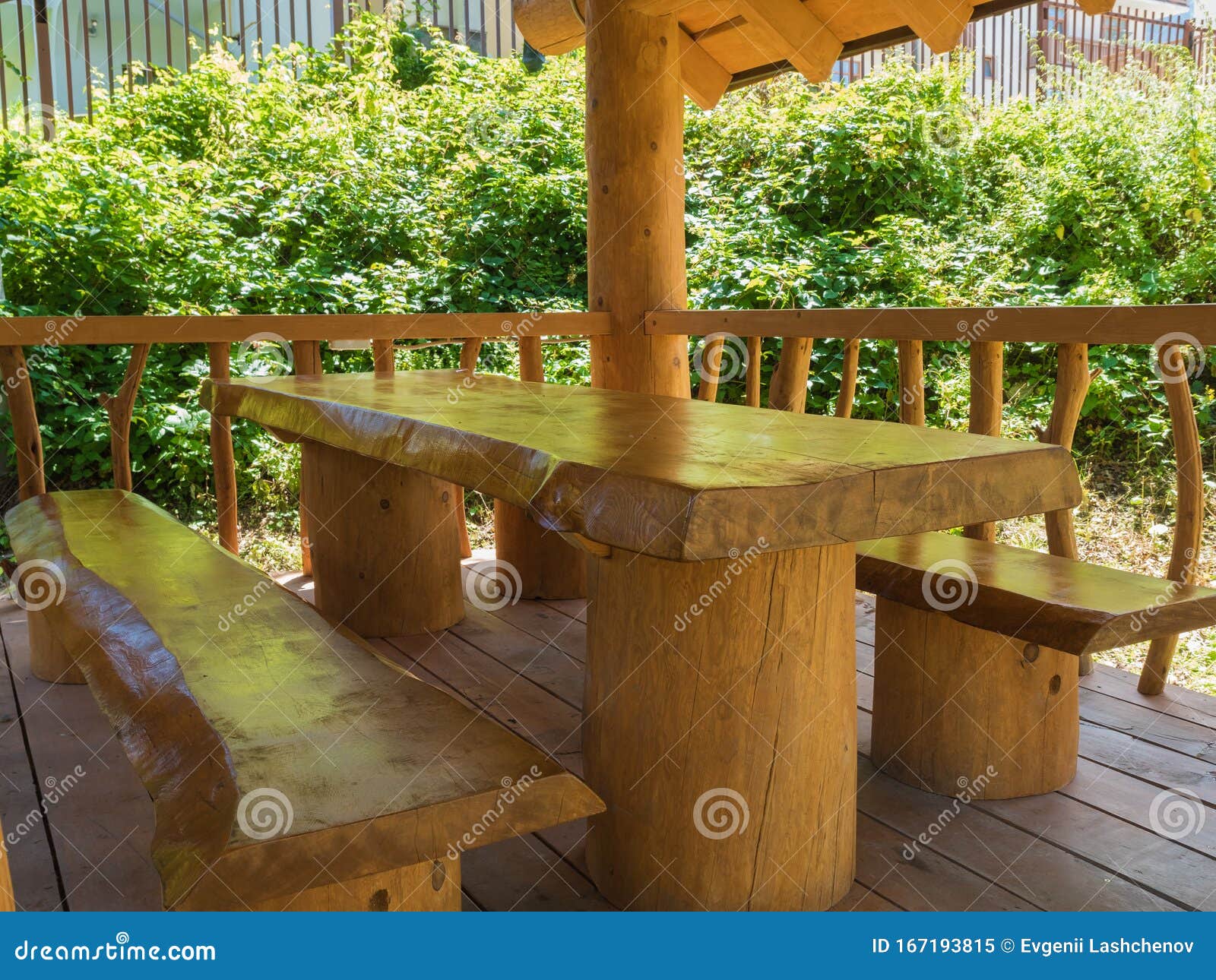 A Table and Two Benches Made of Large Solid Wood in Log Cabin Stock ...