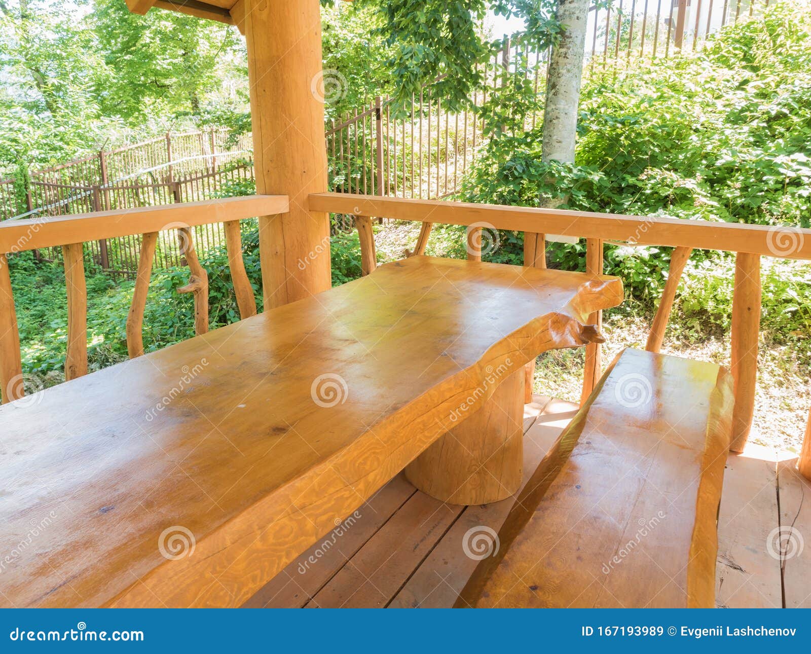 A Table and Two Benches Made of Large Solid Wood in Log Cabin Stock ...