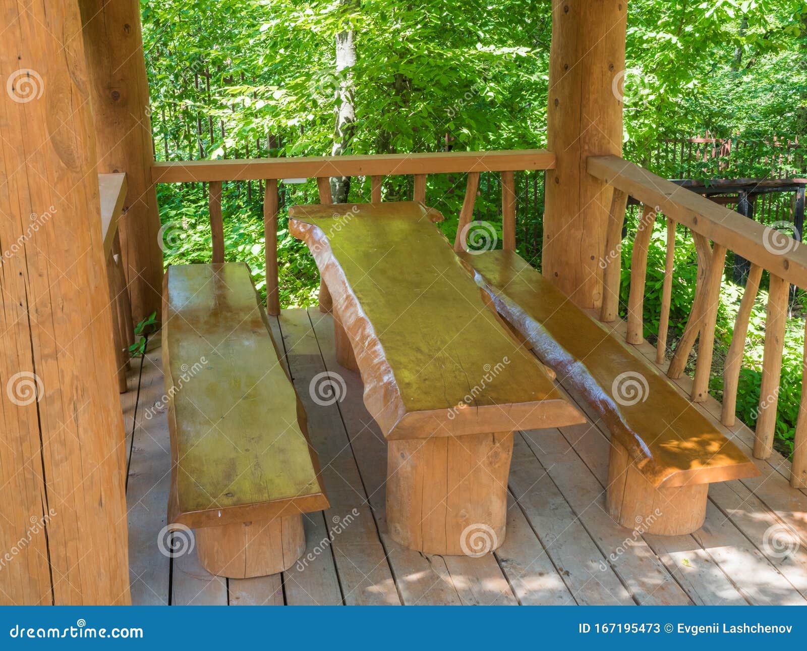 A Table and Two Benches Made of Large Solid Wood in Log Cabin Stock ...