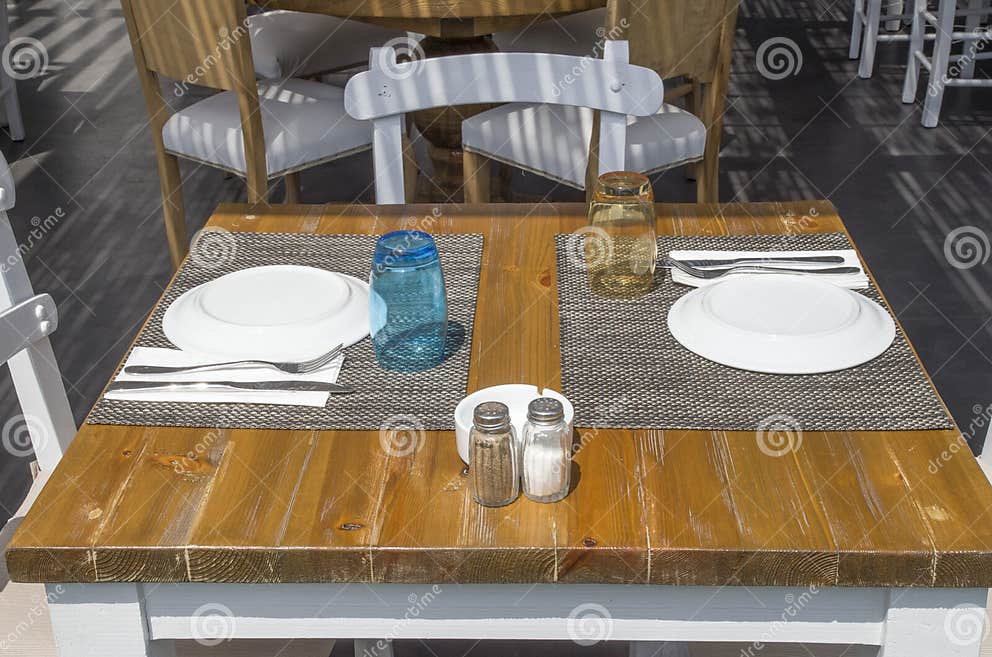Table with Two Empty Inverted Plates in a Restaurant Stock Image ...
