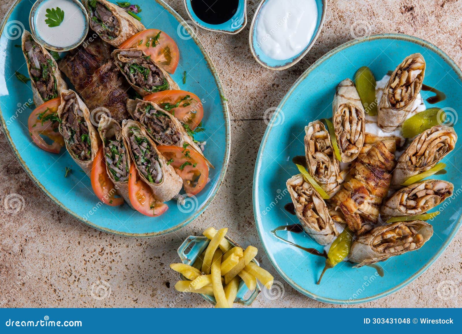 Table with Two Plates of Chicken Shawarma and Beef Shawarma Stock Photo ...