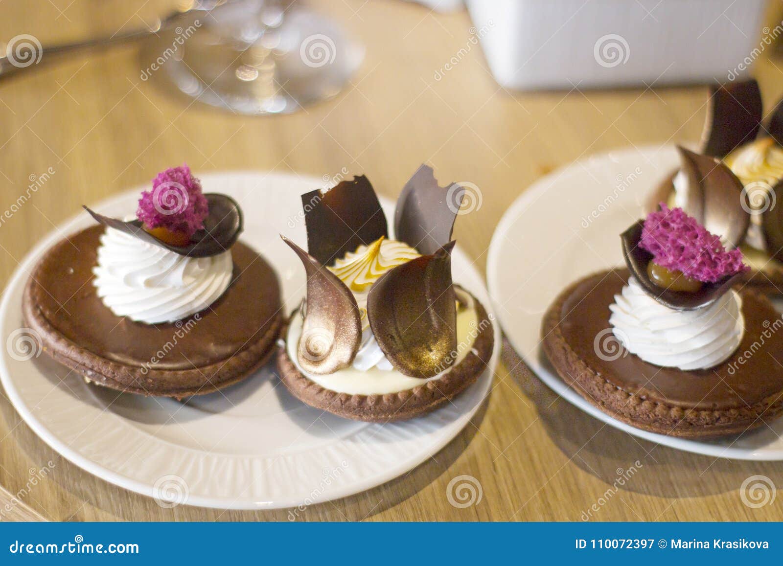Two Plates with Two Pastry Cakes in Chocolate Glaze and Whipped Stock ...
