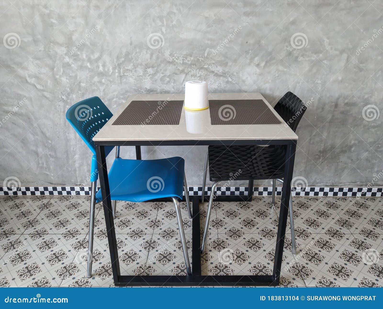 A Table for Two in a Restaurant. a Box of Tissue Paper in the Middle ...