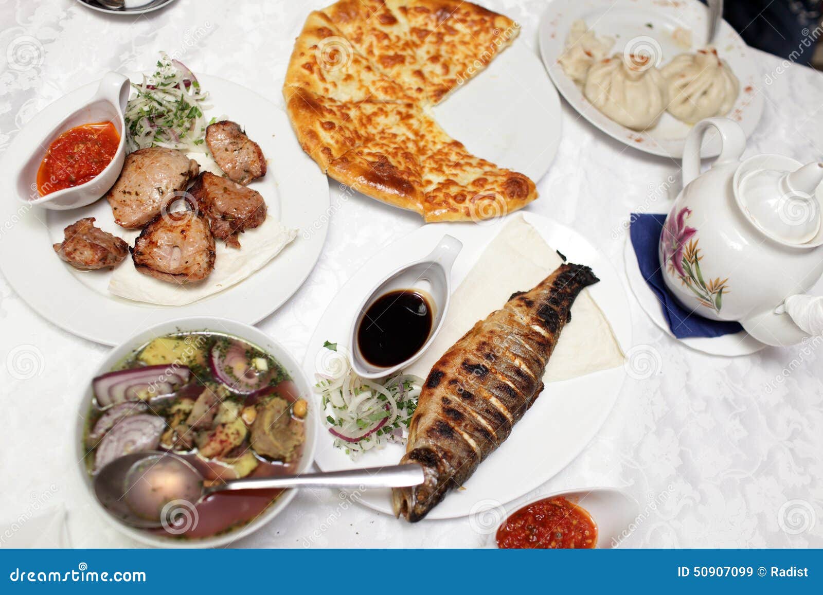 Table with various dishes stock image. Image of cooked - 50907099