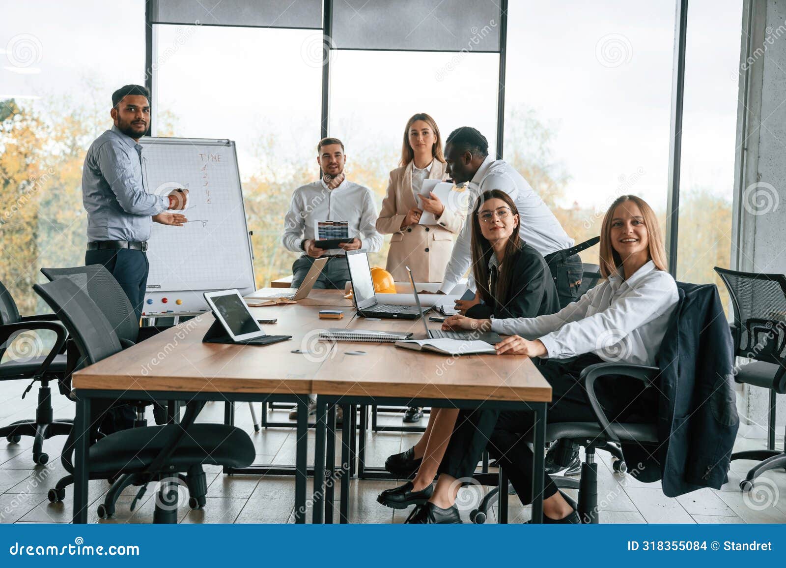 By the Table and with Whiteboard. Group of Office Workers are Together ...