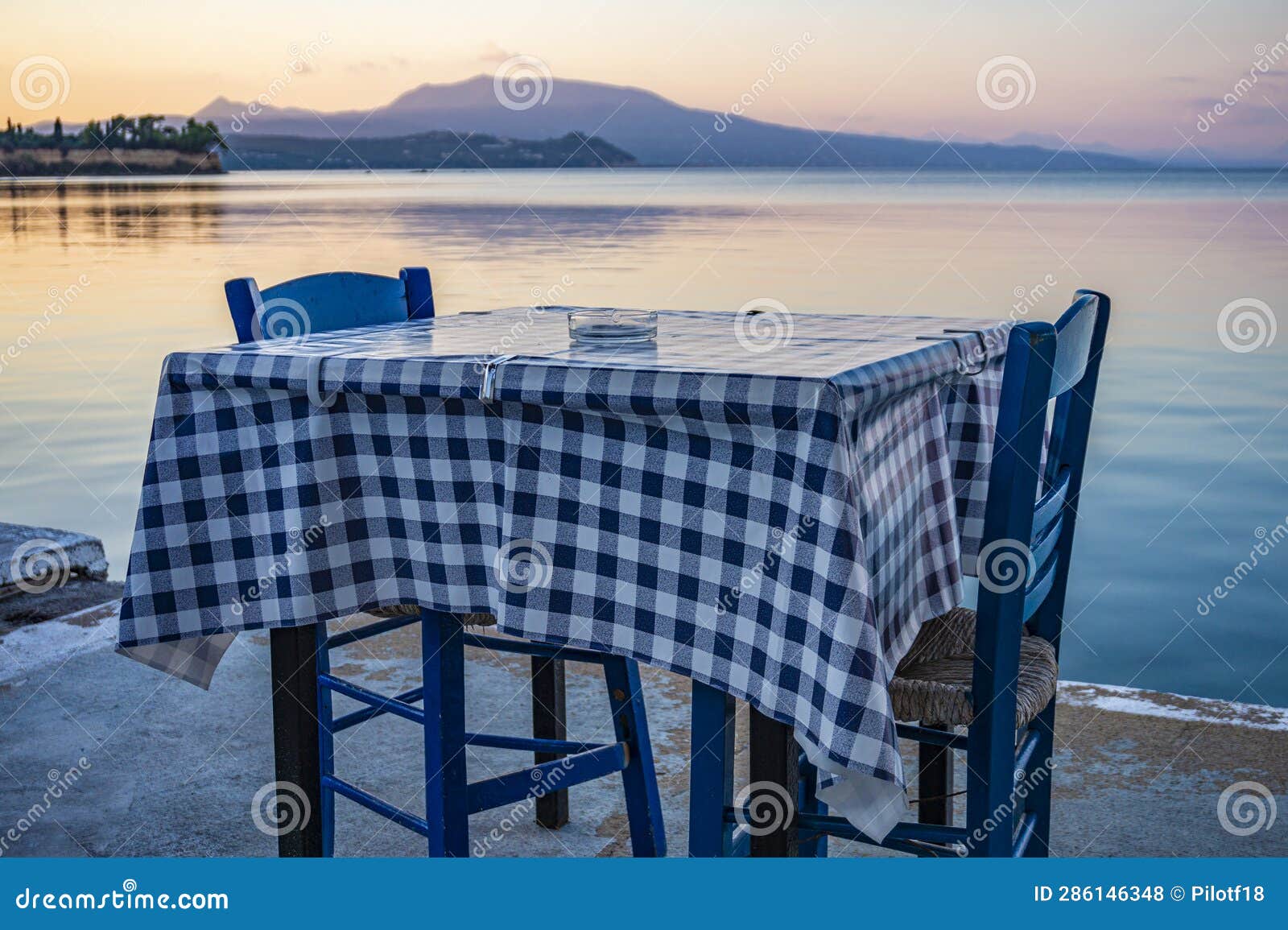 Tables with Beautiful Seaside View at Koroni in Messenia, Greece Stock ...