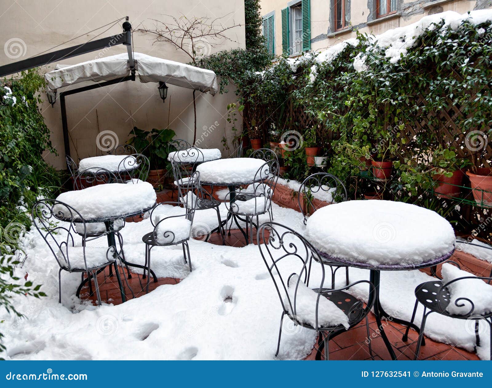 Tables and Chairs Covered in Deep Snow. Stock Image - Image of chairs ...
