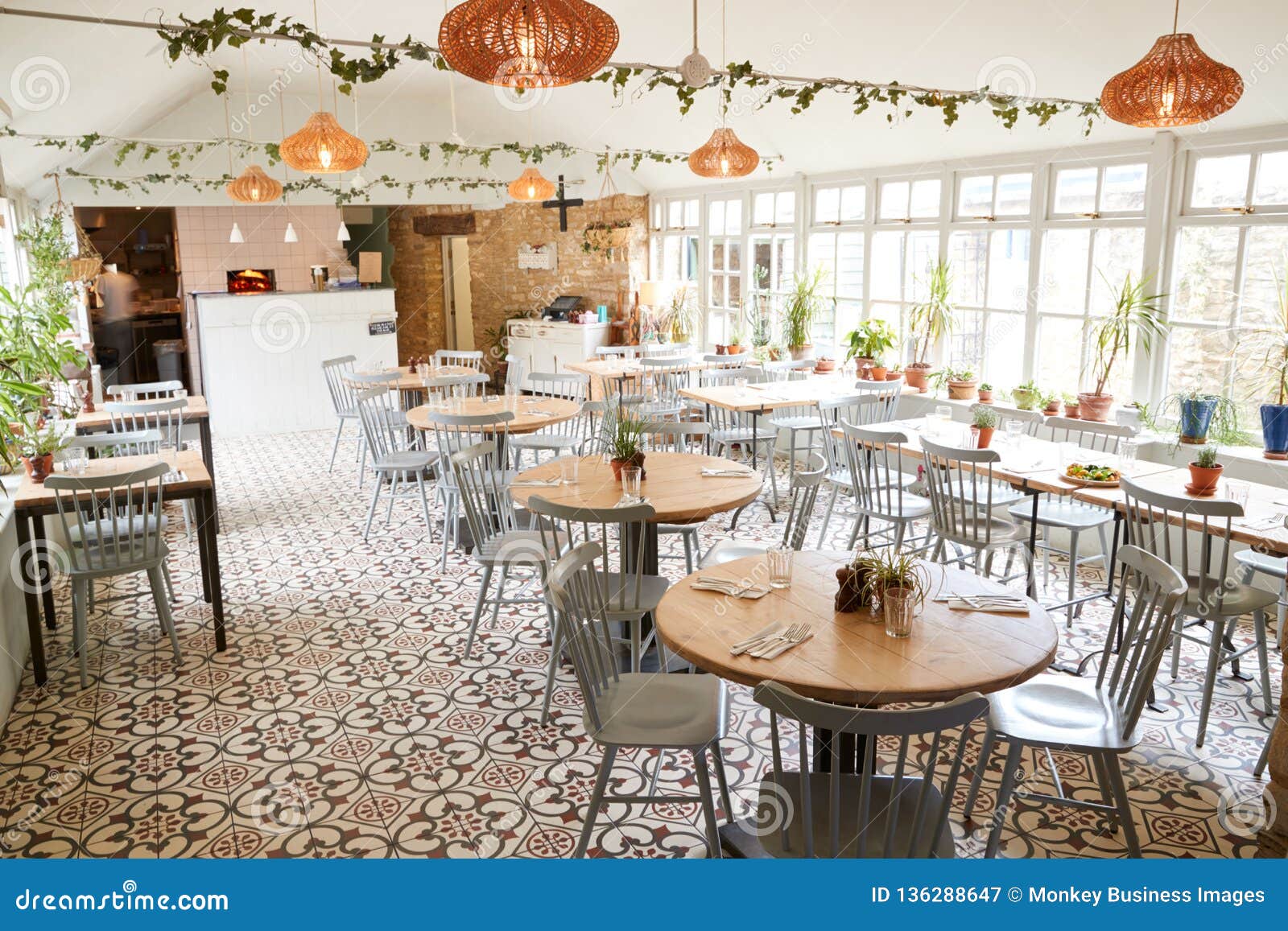 Tables and Chairs in an Empty Restaurant in Bright Daylight Stock Image ...