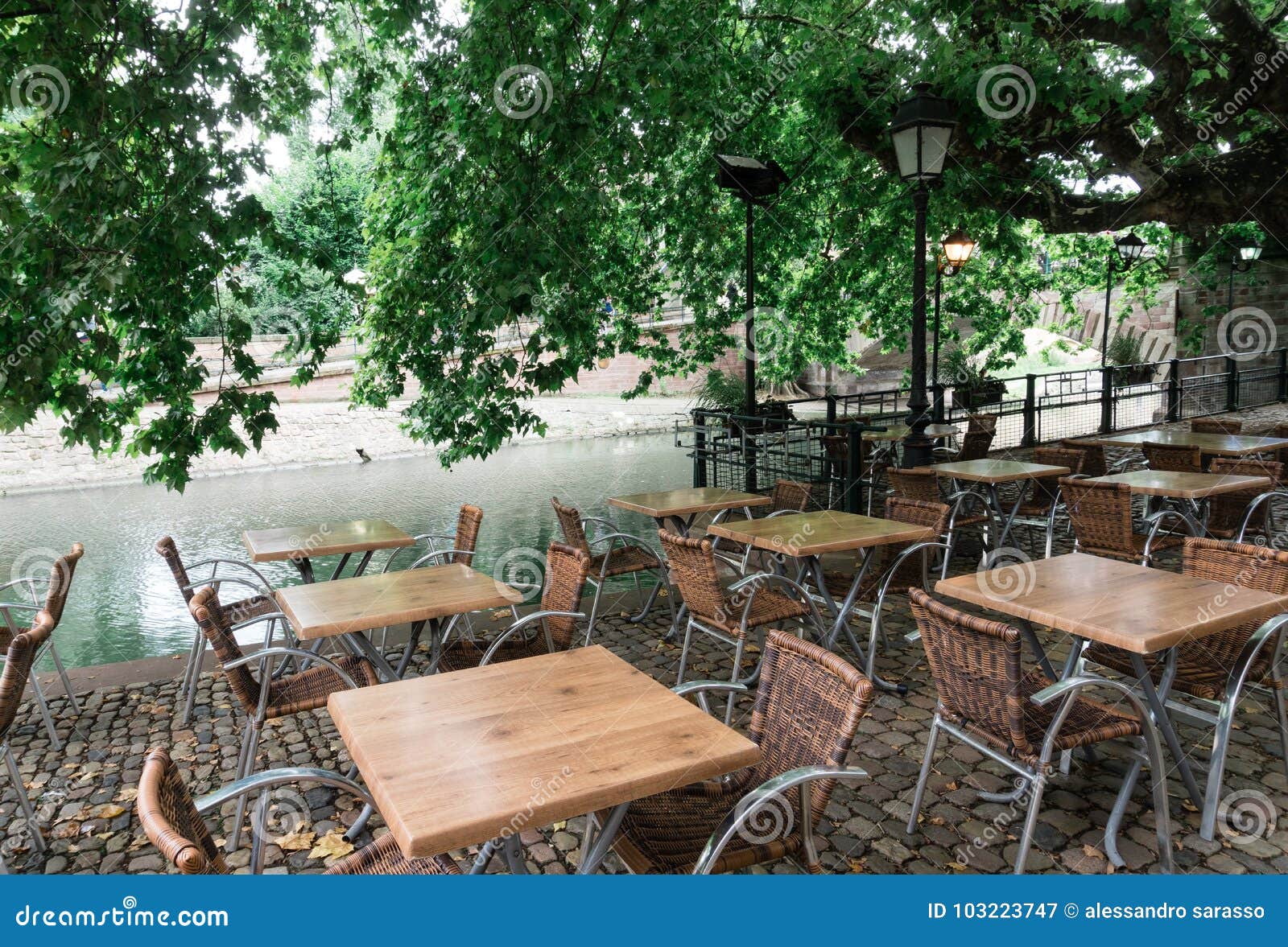 Tables with Chairs in a Restaurant Along a Canal of Strasbourg Stock ...