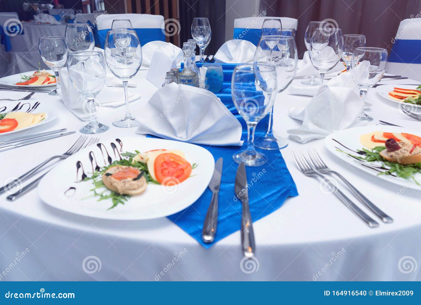 Tables and Chairs in the Restaurant with Food and Full Set Preparation ...