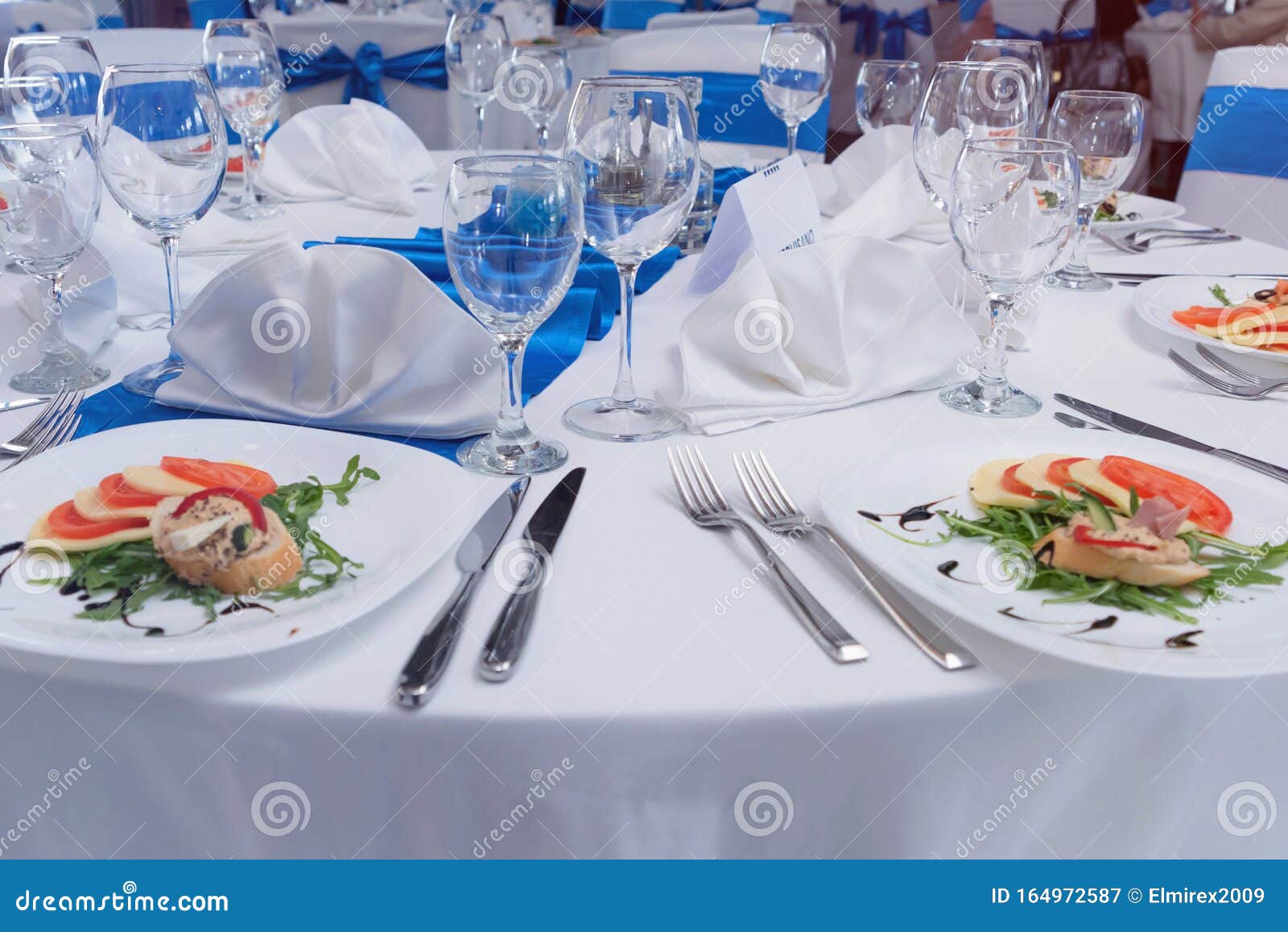 Tables and Chairs in the Restaurant with Food and Full Set Preparation ...