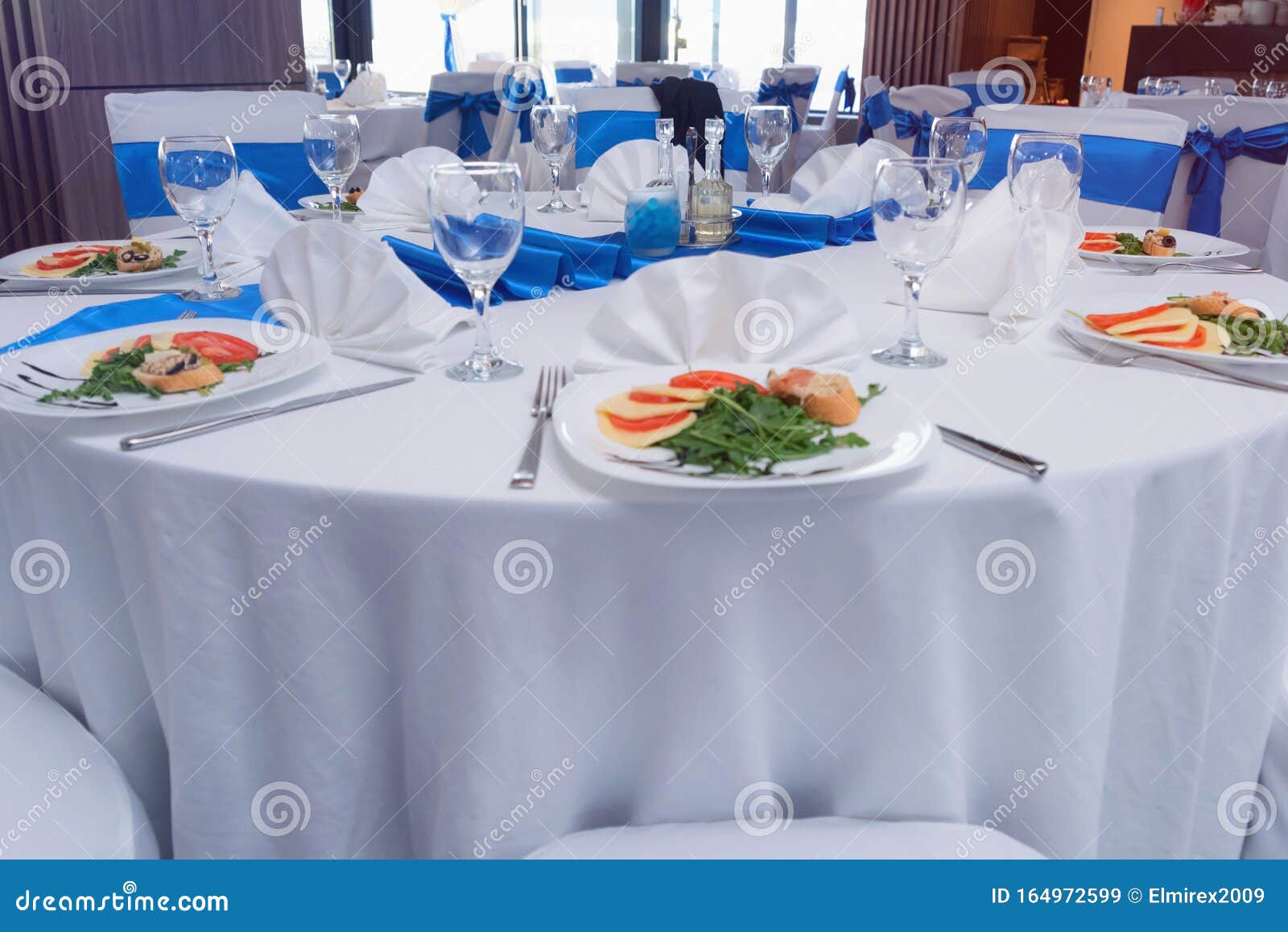 Tables and Chairs in the Restaurant with Food and Full Set Preparation ...
