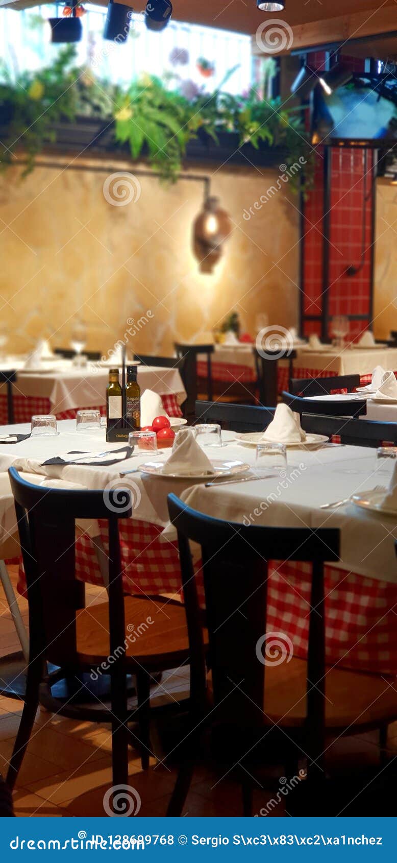 Tables in a restaurant editorial stock photo. Image of lunch - 128699768