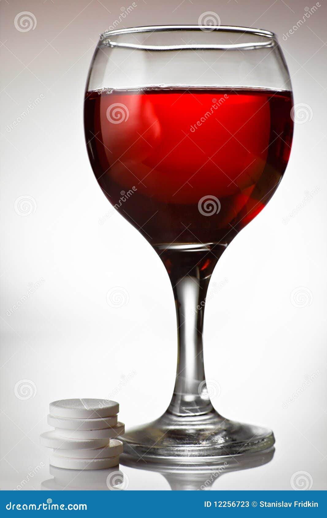 Tablet and alcohol stock image. Image of glass, drink - 12256723
