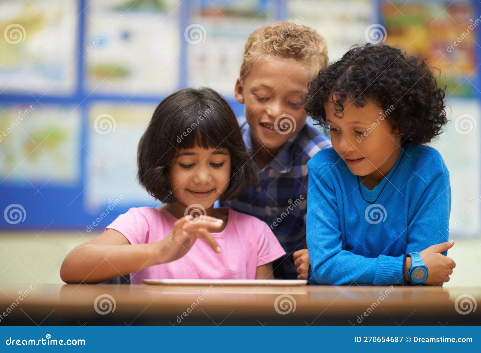 Tablet-assisted Learning. Three School Students Working on a Digital ...