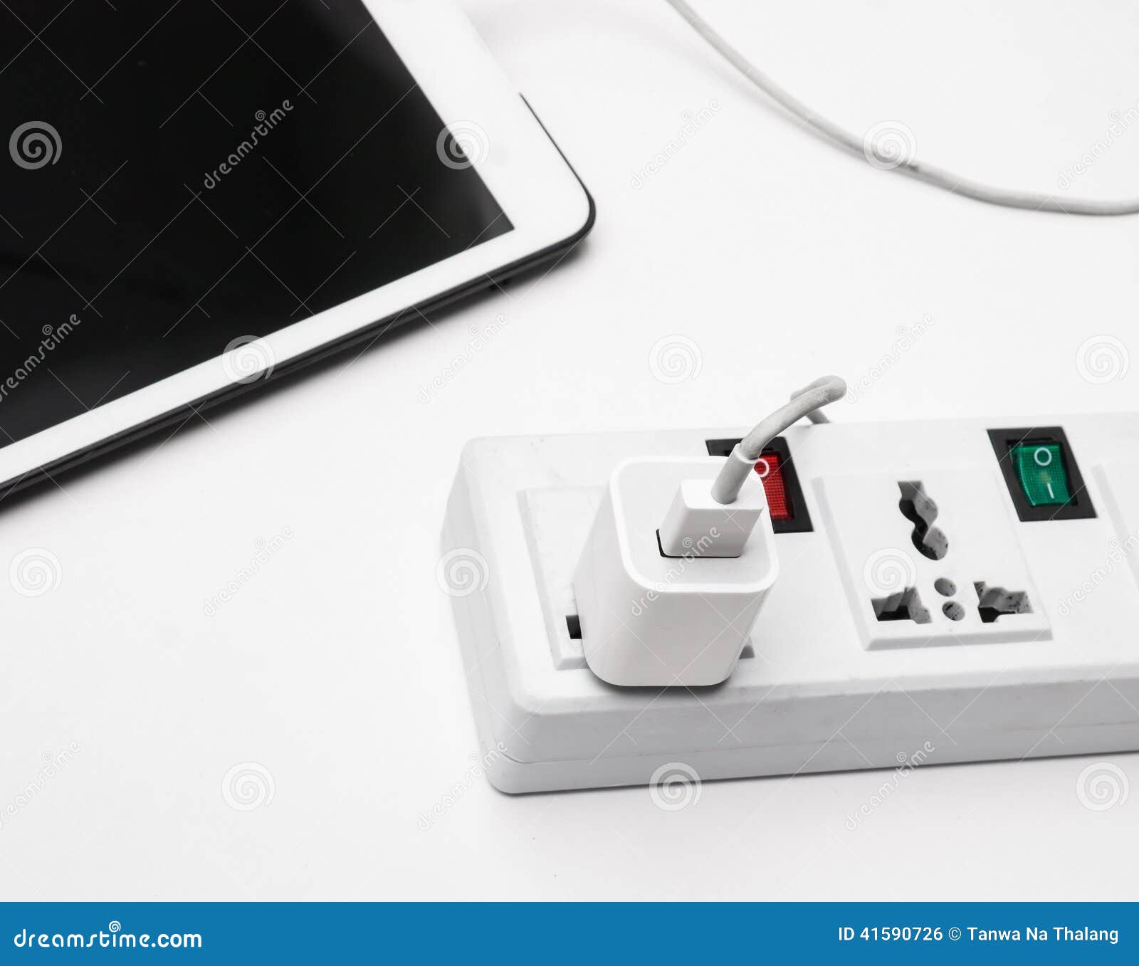 Tablet , Battery Charger and Bloc Multiprise 3 Prises Stock Photo ...