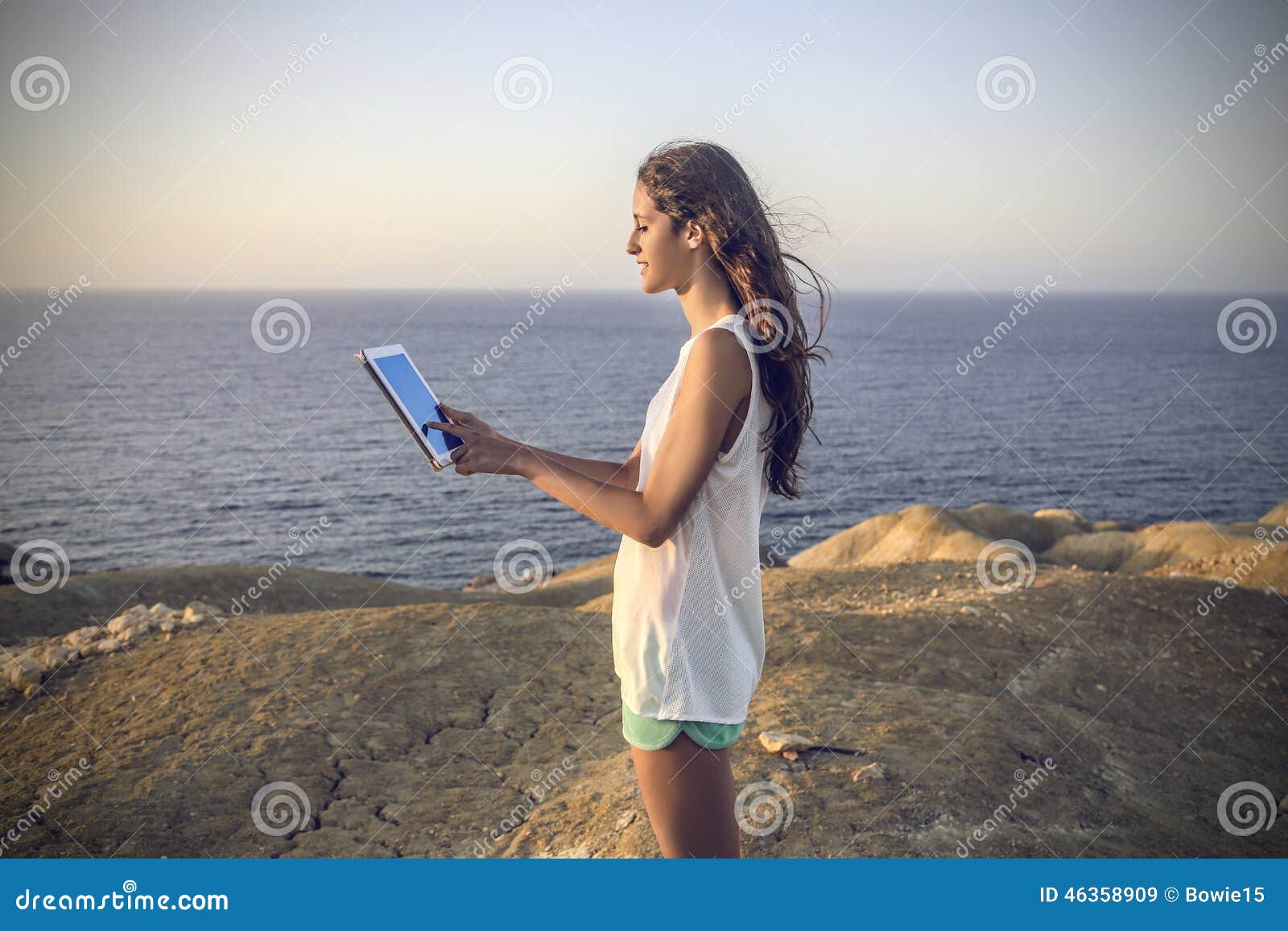 A tablet at the beach stock image. Image of fashion, rock - 46358909