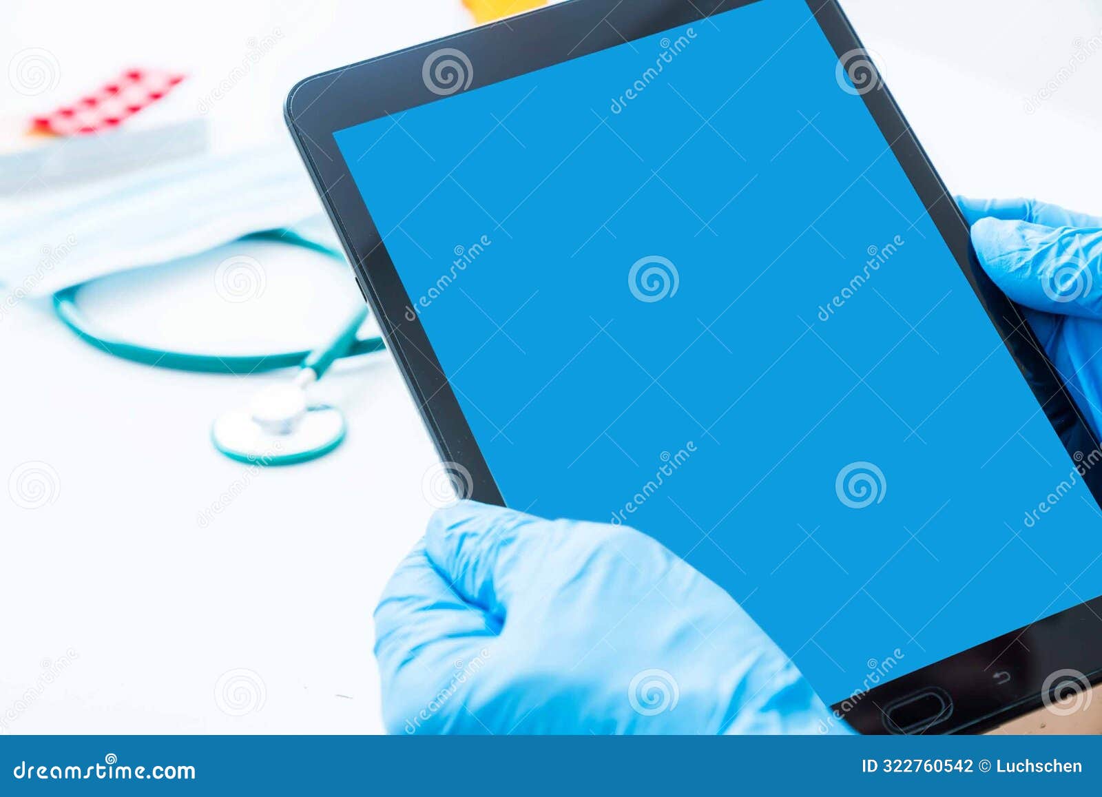 Tablet with a Blue Screen in the Hands of a Medical Doctor Stock Photo ...