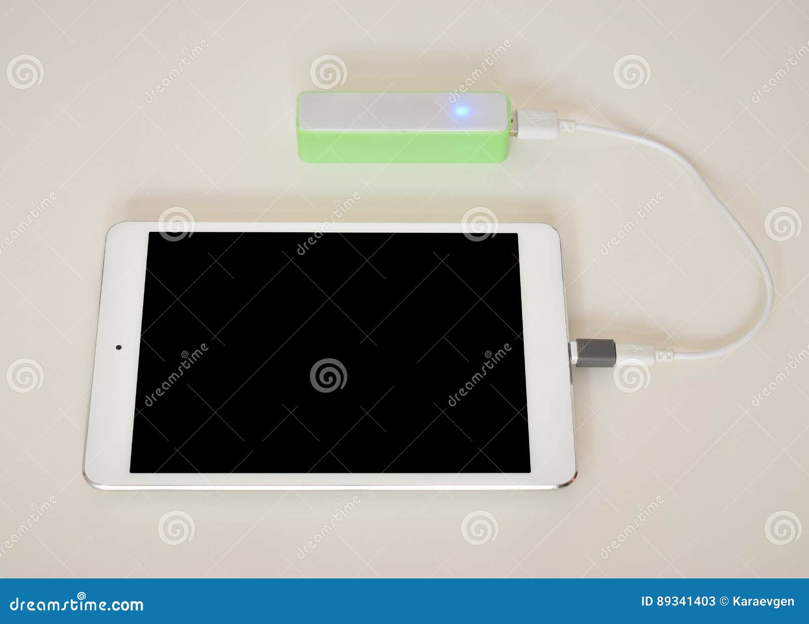 Tablet with a charging stock image. Image of copyspace - 89341403
