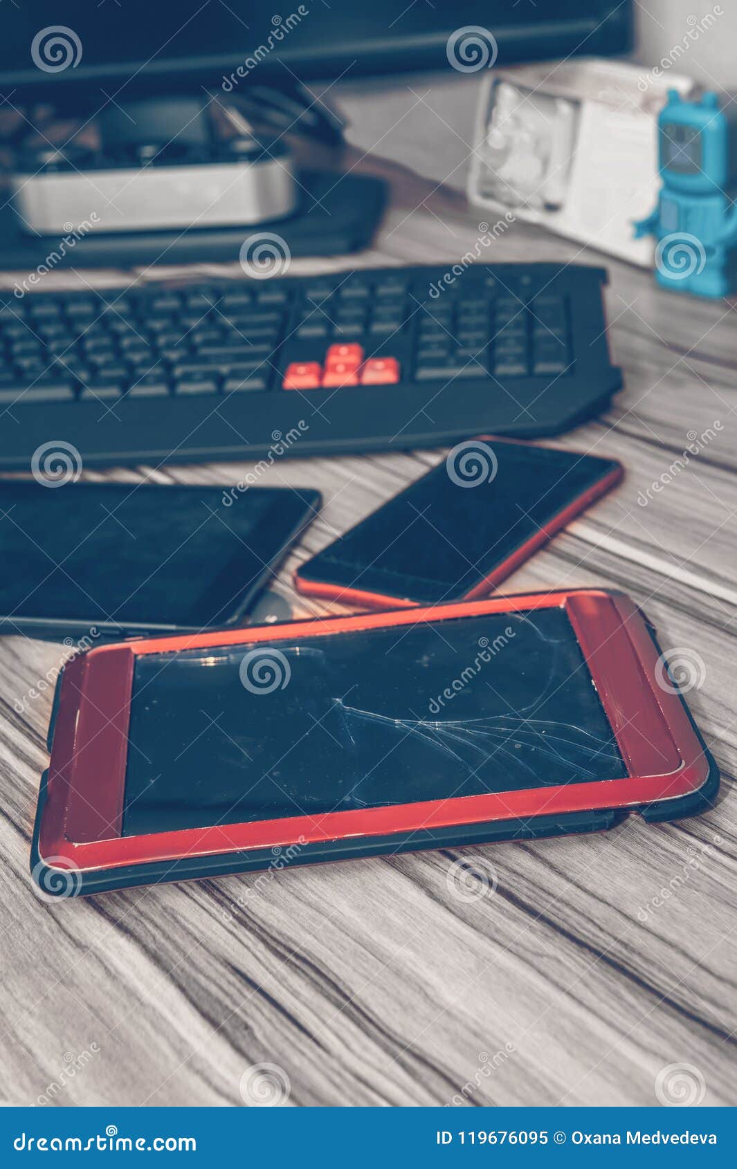 Tablet Computer with Broken Glass, Lying on the Desktop with the Phone ...