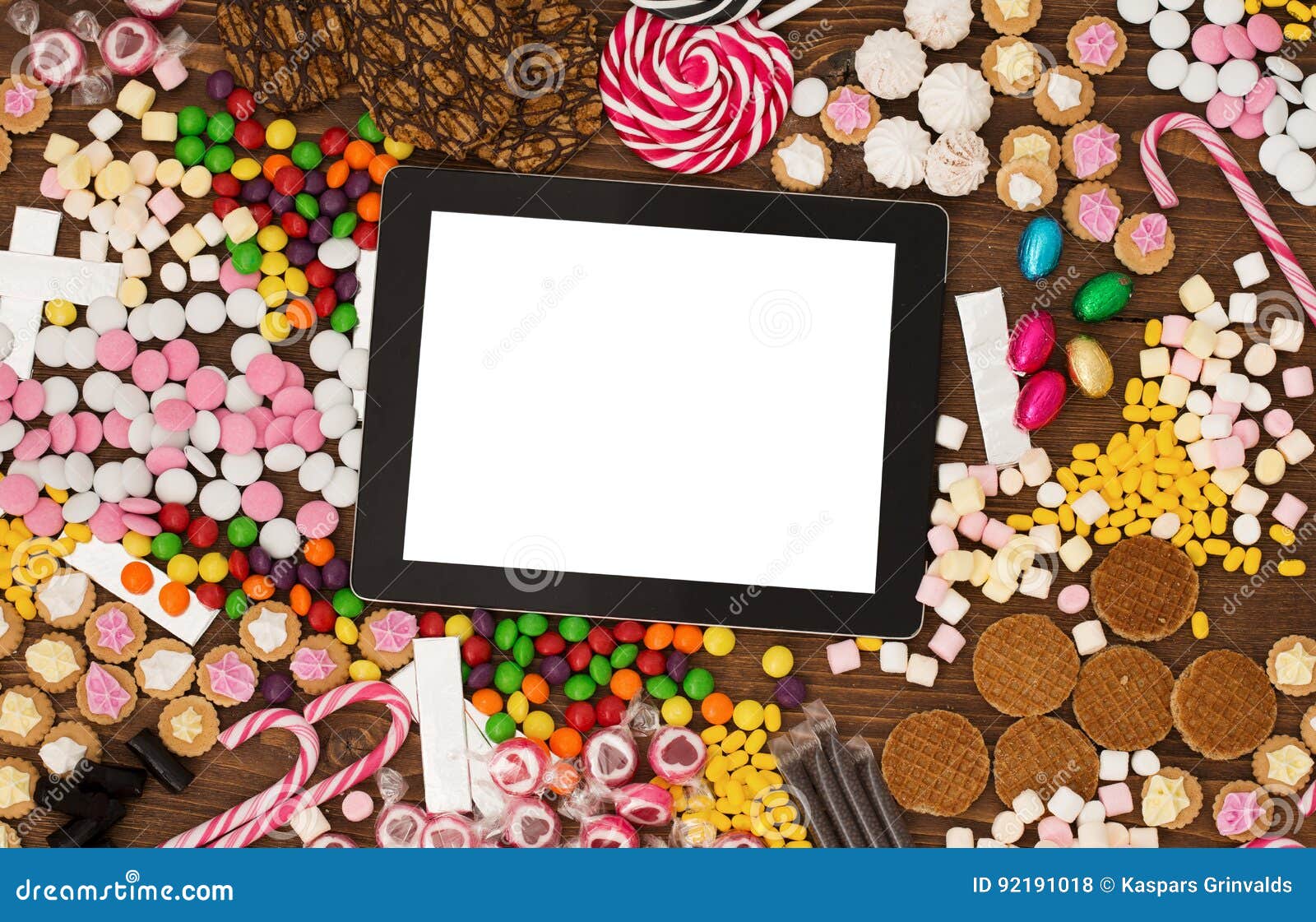 Tablet computer and candy stock photo. Image of candy - 92191018