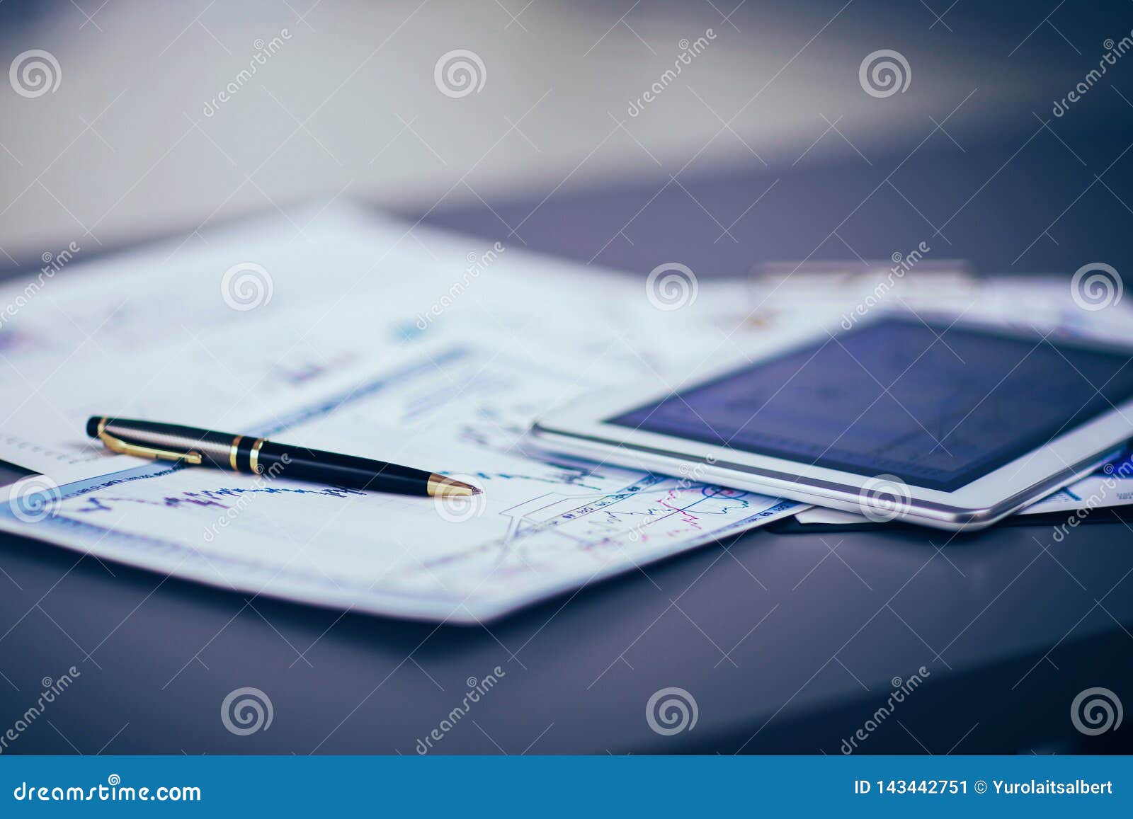 Tablet Computer and Financial Diagrams in the Workplace Stock Image ...
