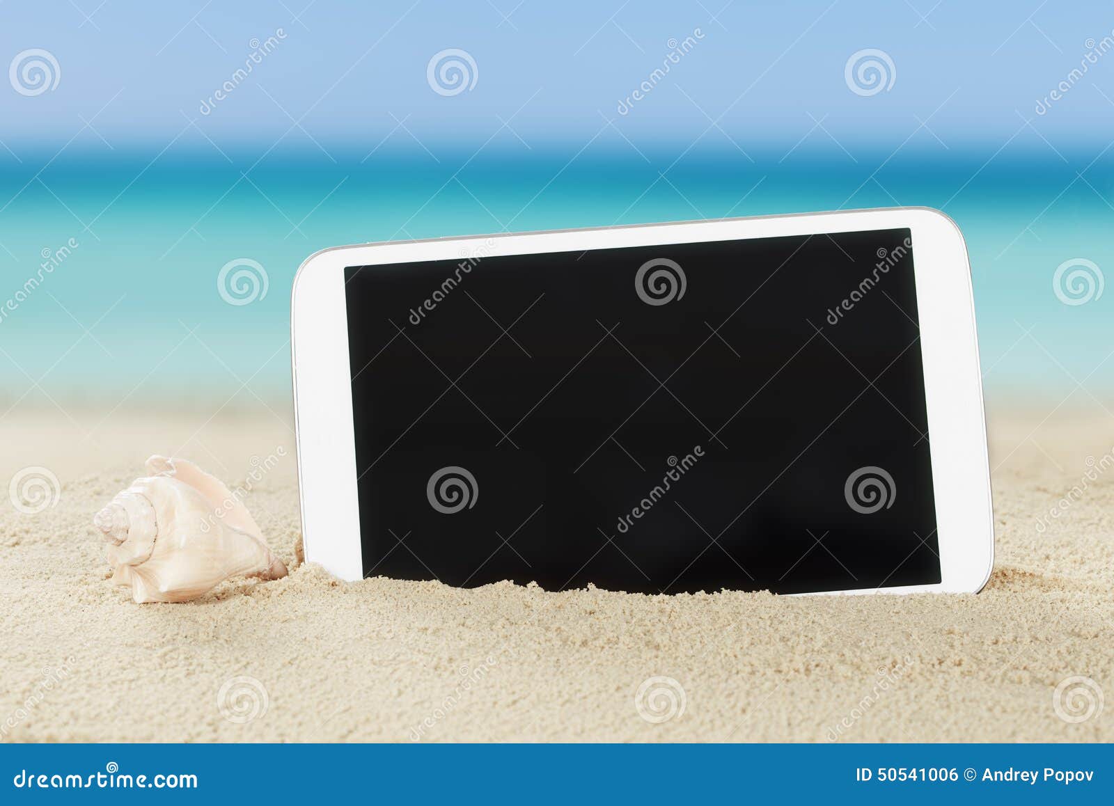Tablet Computer and Shell on Sand Stock Photo - Image of destination ...
