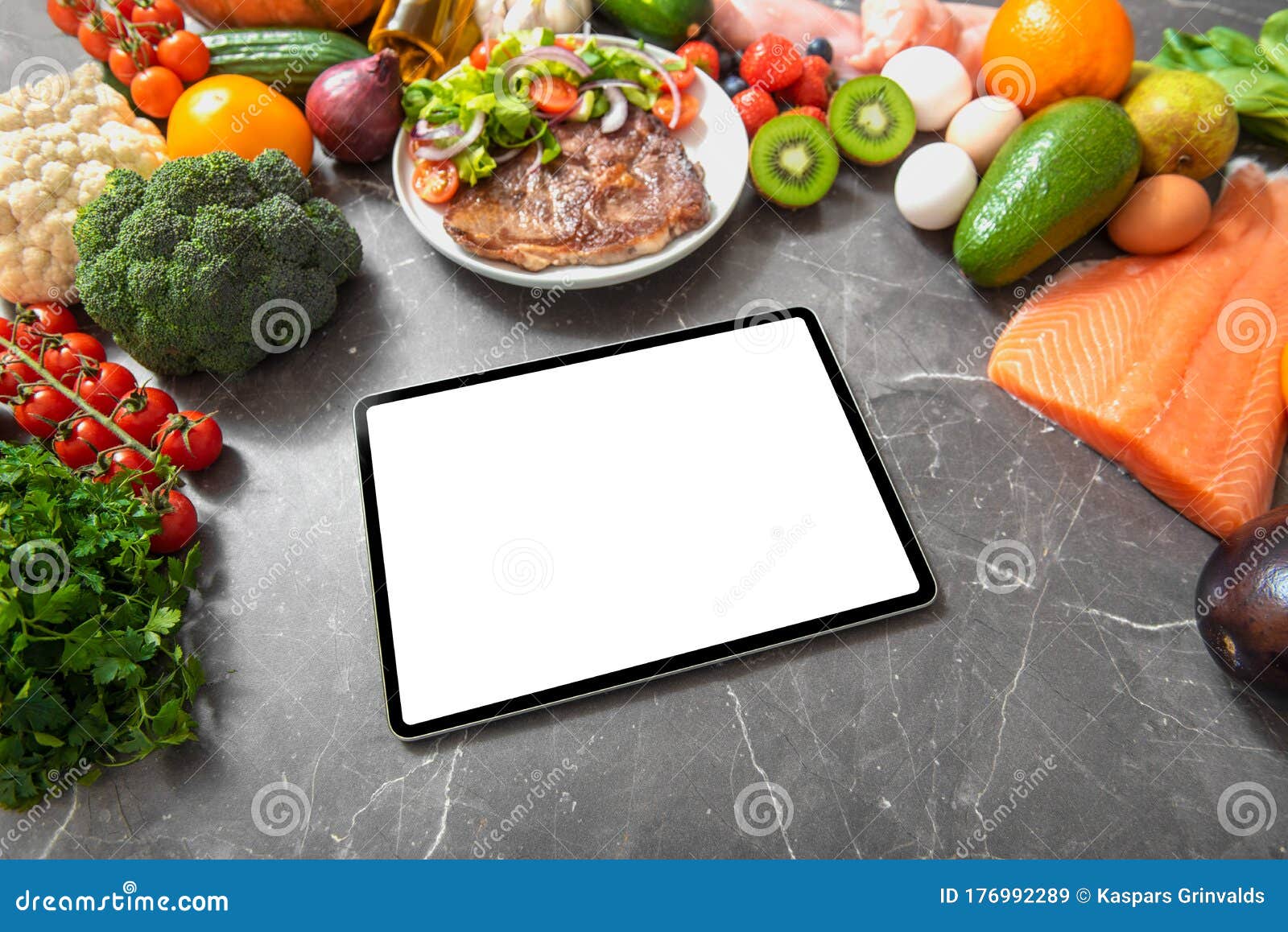 Tablet Computer on a Kitchen Table Surrounded by Healthy Products Stock ...